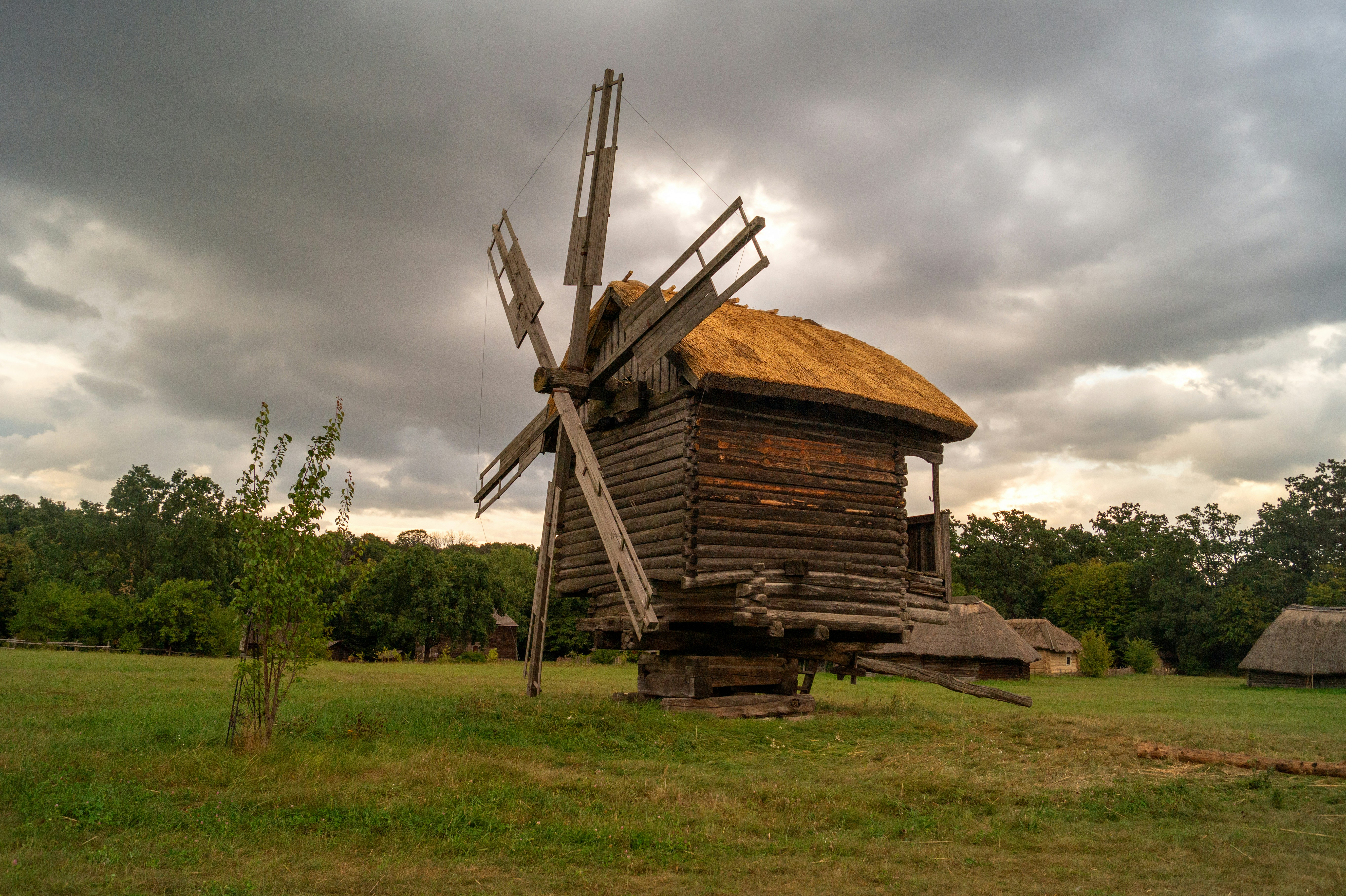 Weathered Windmill Sentinel in an Open Meadow