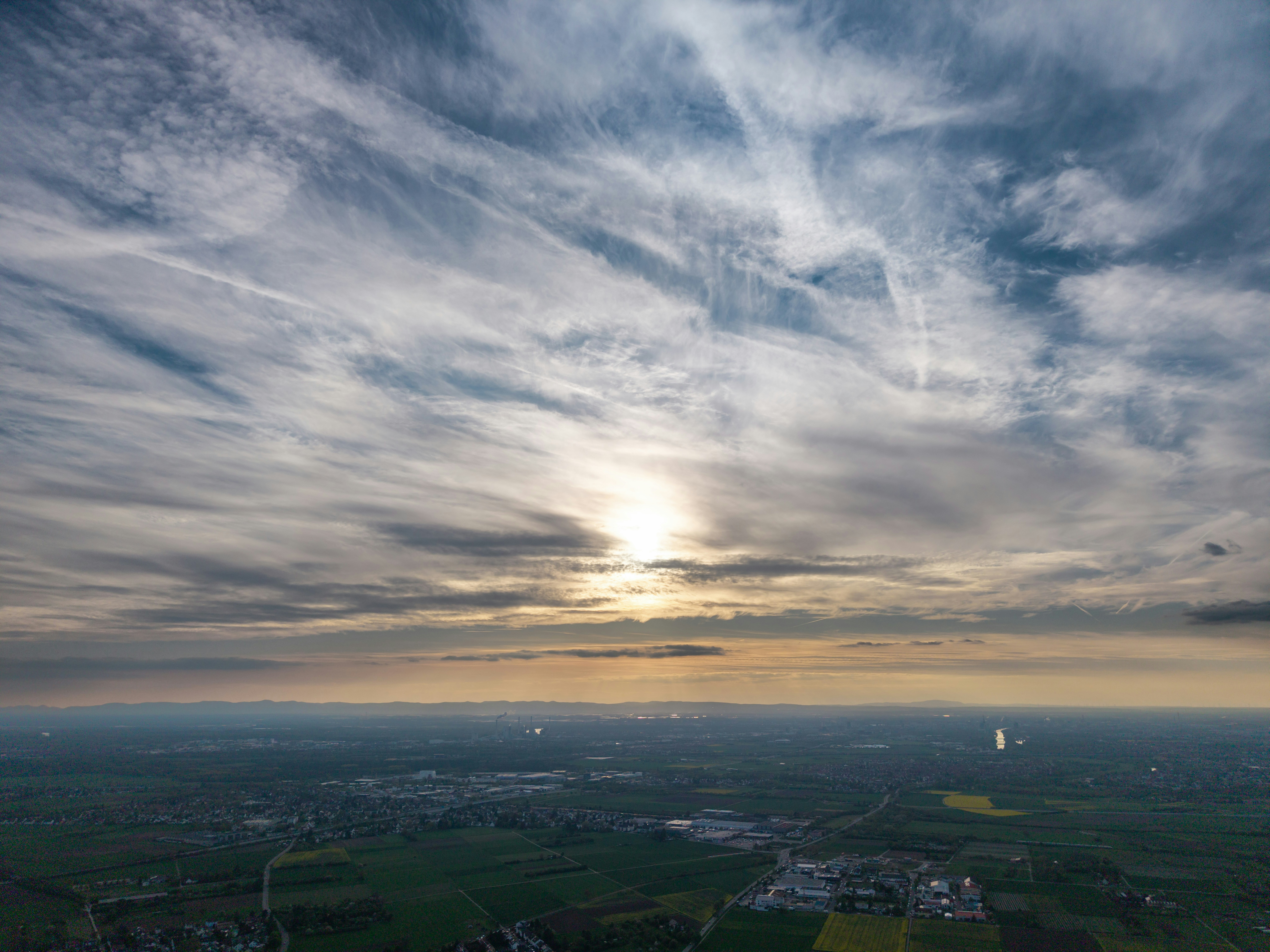 Sunlit Horizon: A Quiet Valley Under a Velvet Sky