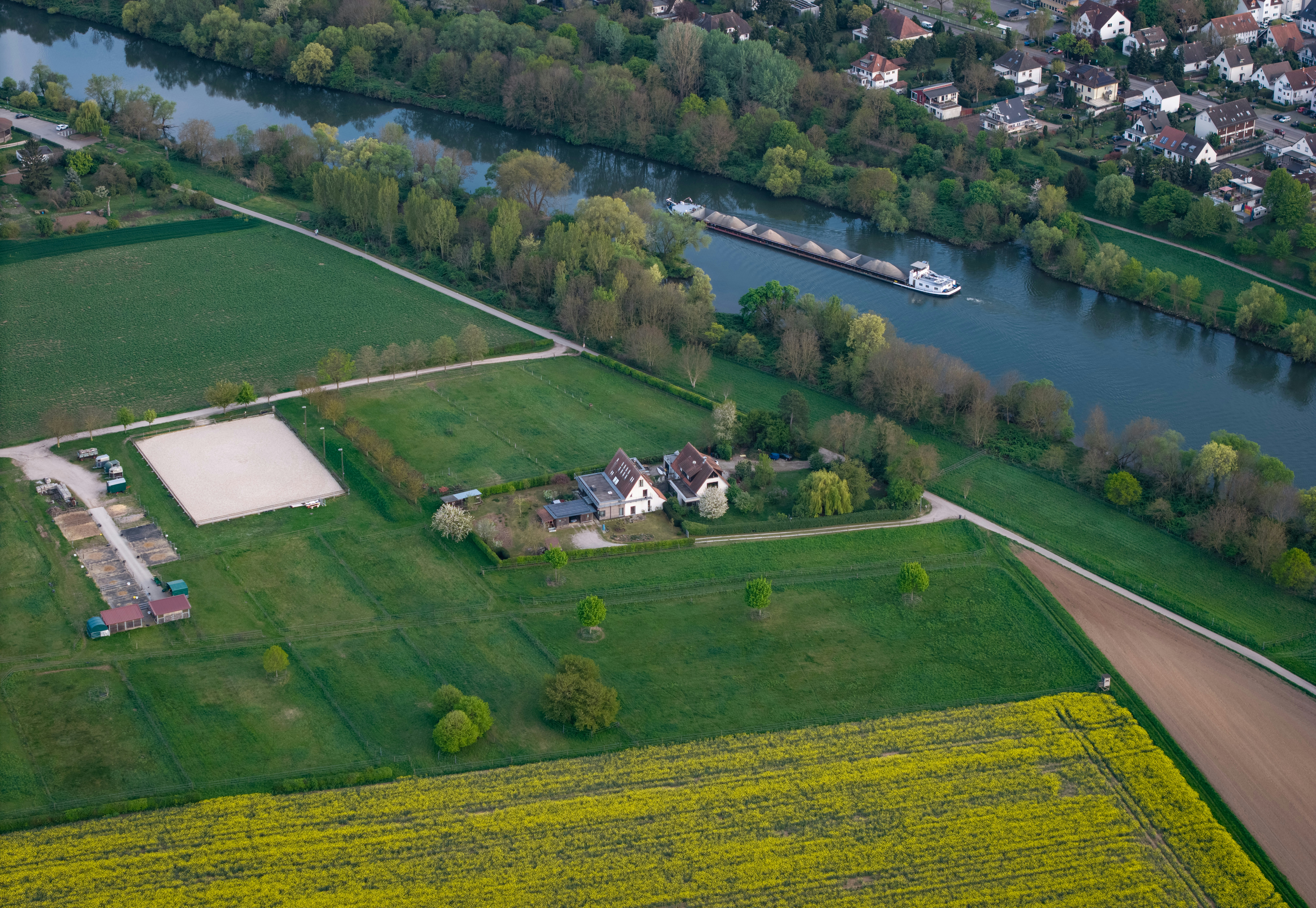 Aerial Overlook: Fields, River, and Village Lines