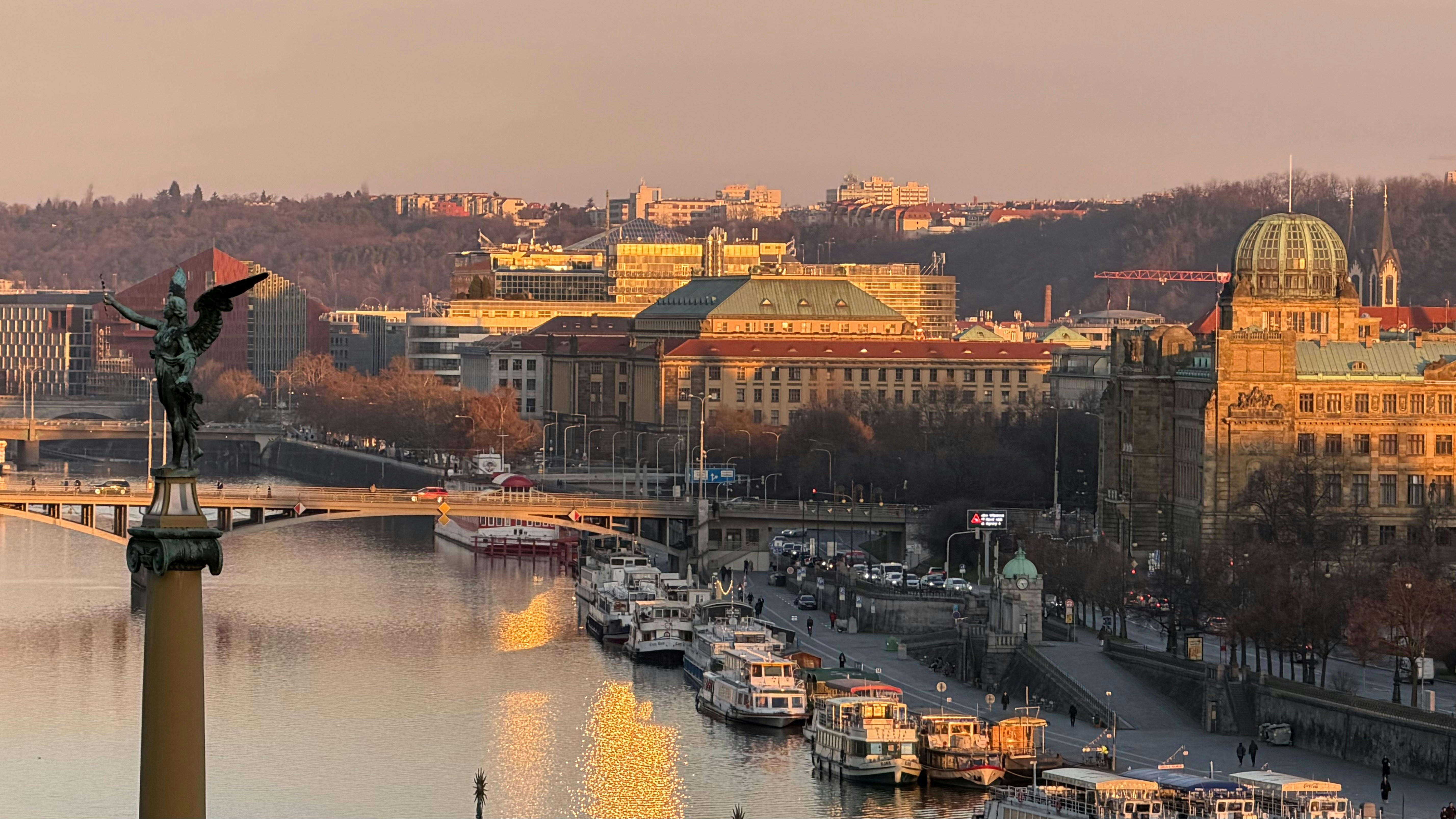 Sunlit Danube: A Riverside Panorama with Classical Domes