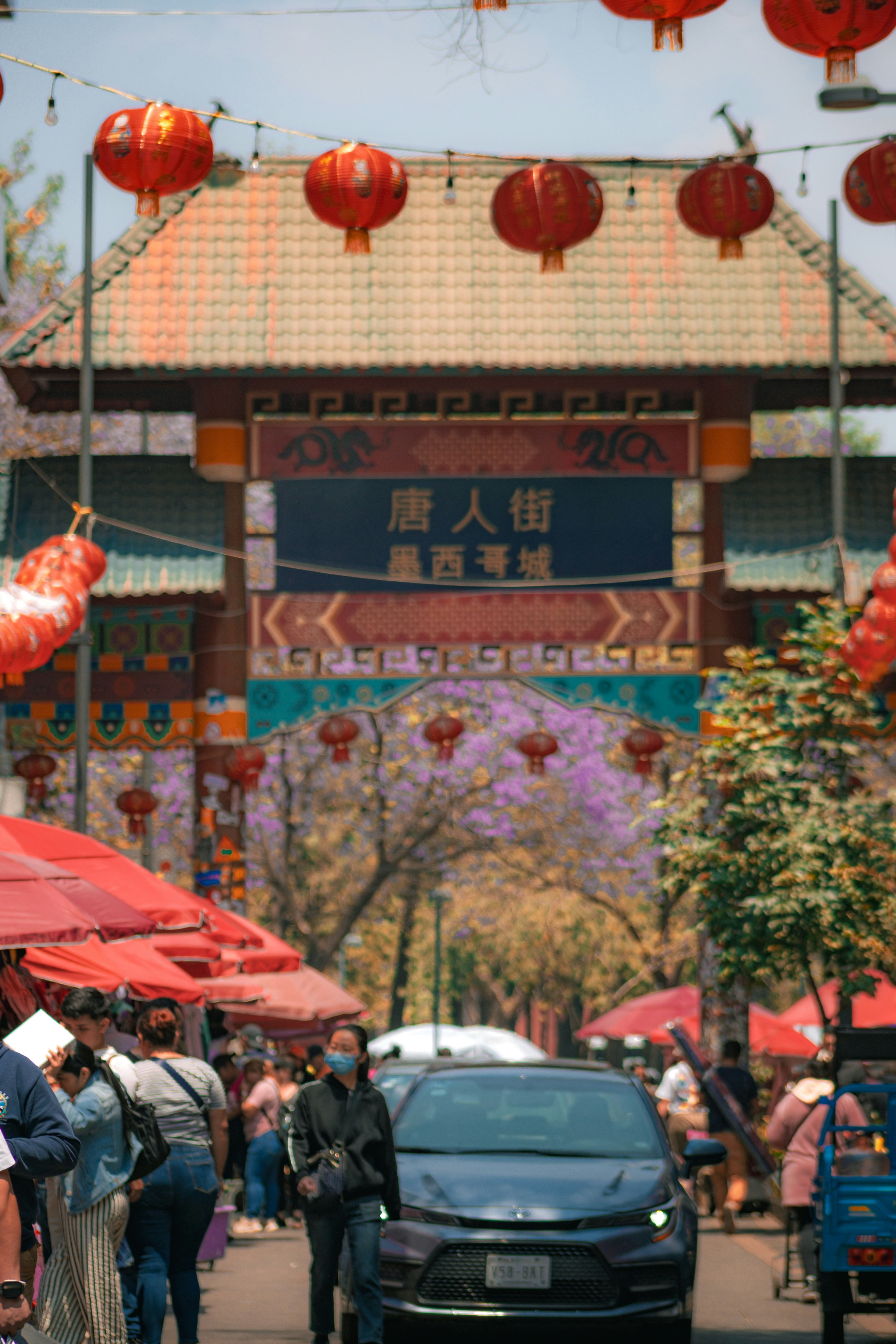 Lanterns, Temples, and Street Life: A Festive Chinese Gate Scene
