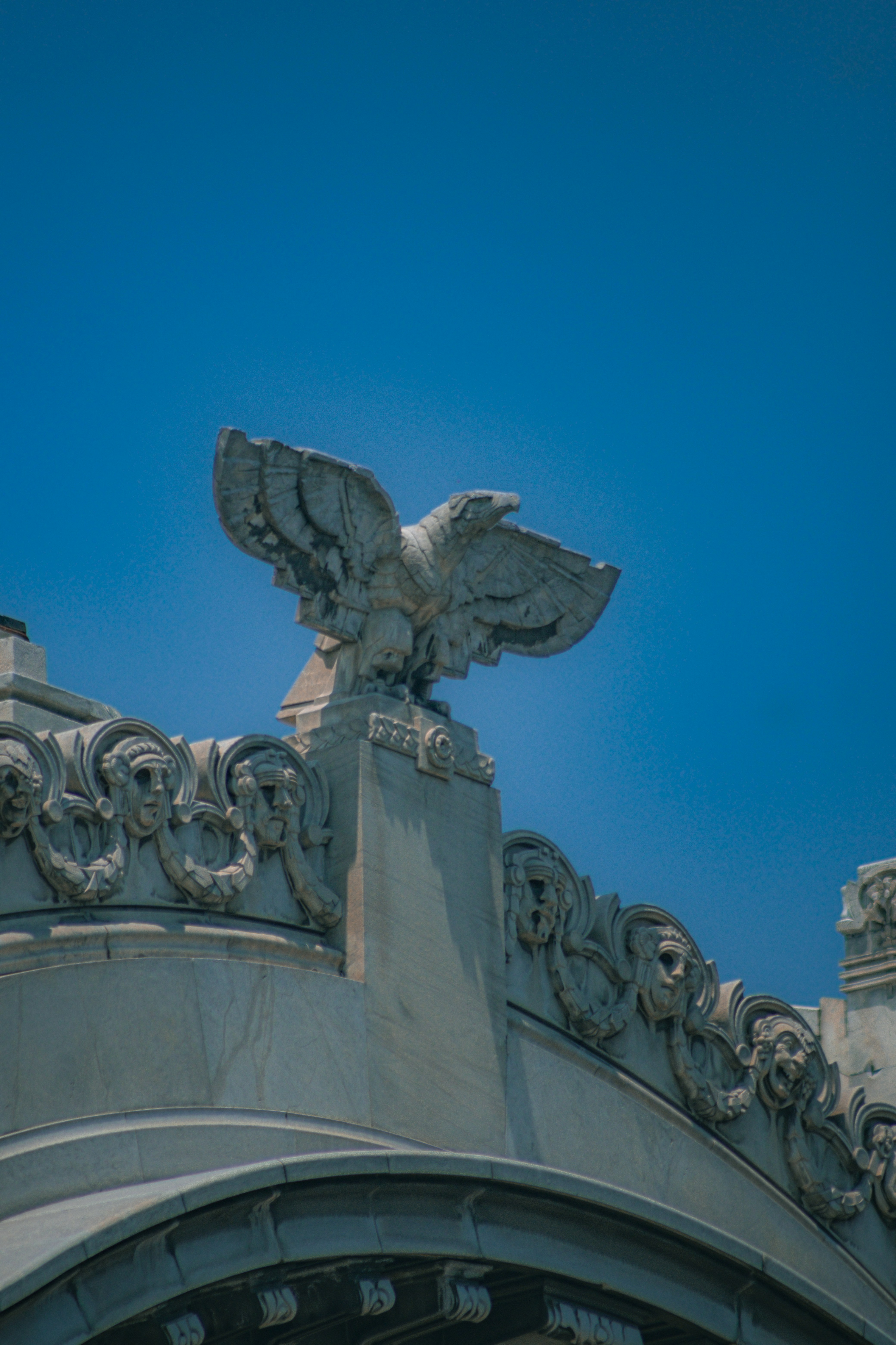 Winged Guardian over a Classical Arch
