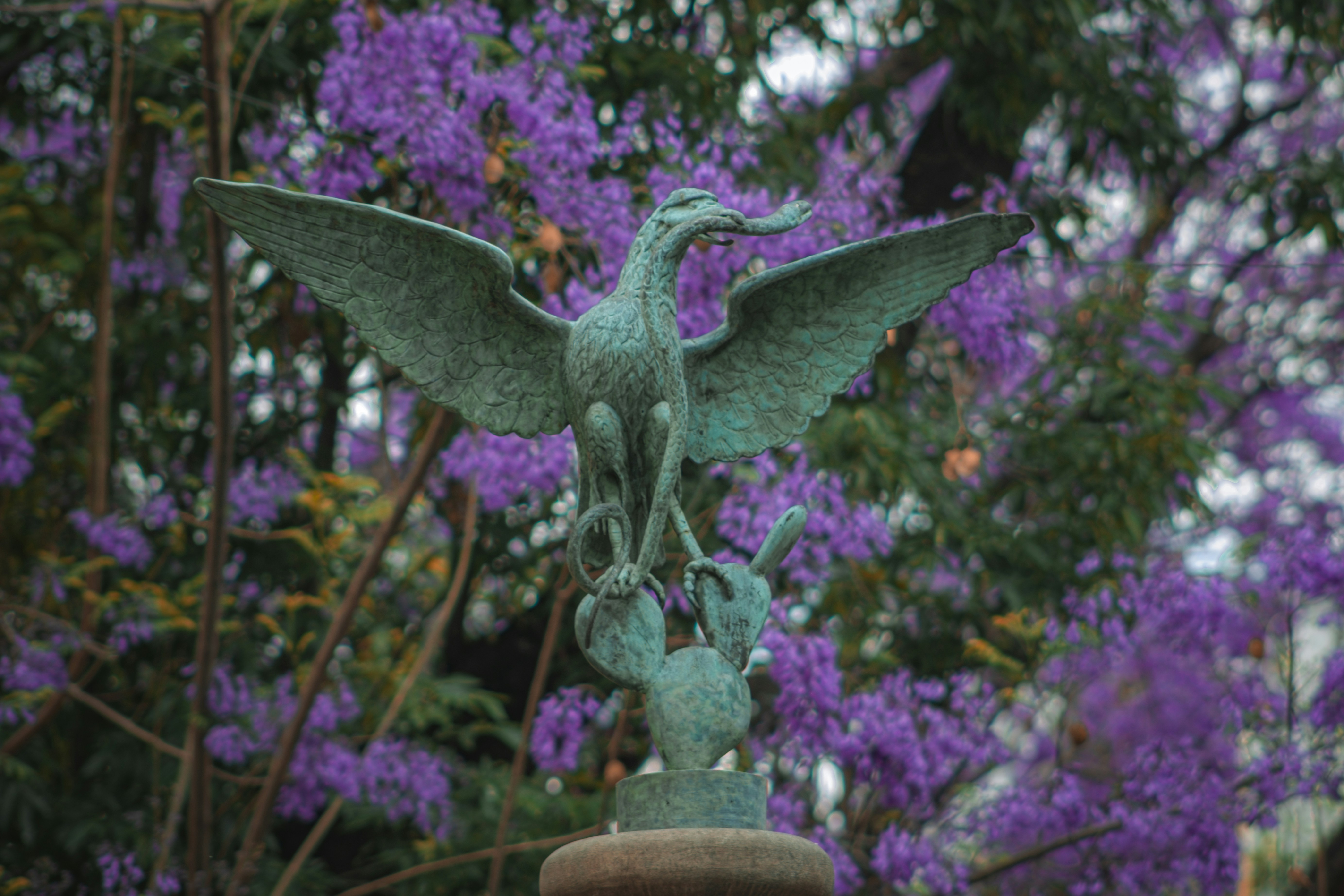 Heron of Bronze under Lavender Bloom