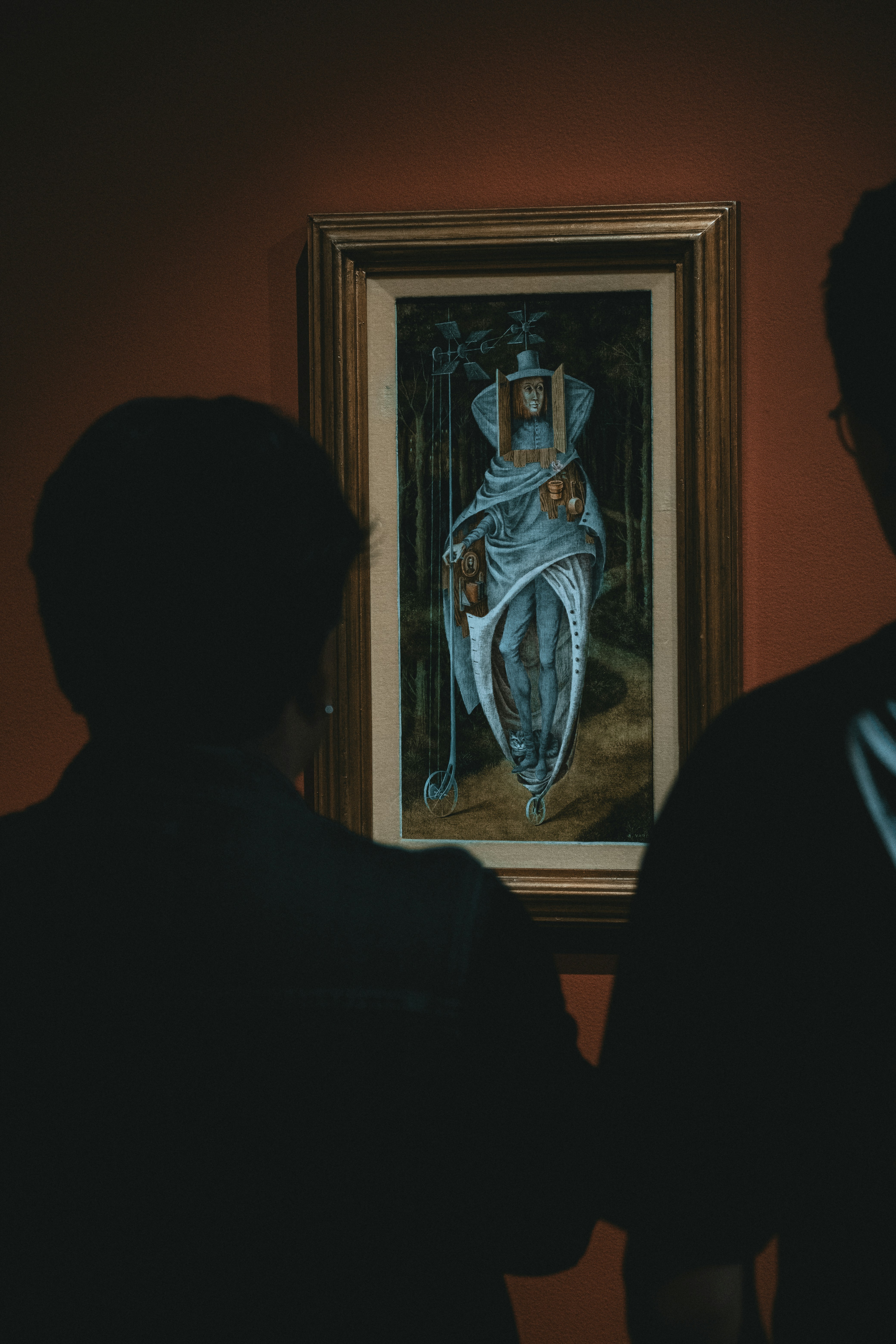 Center Portrait of Visitors Gazing at a Framed Religious Artwork