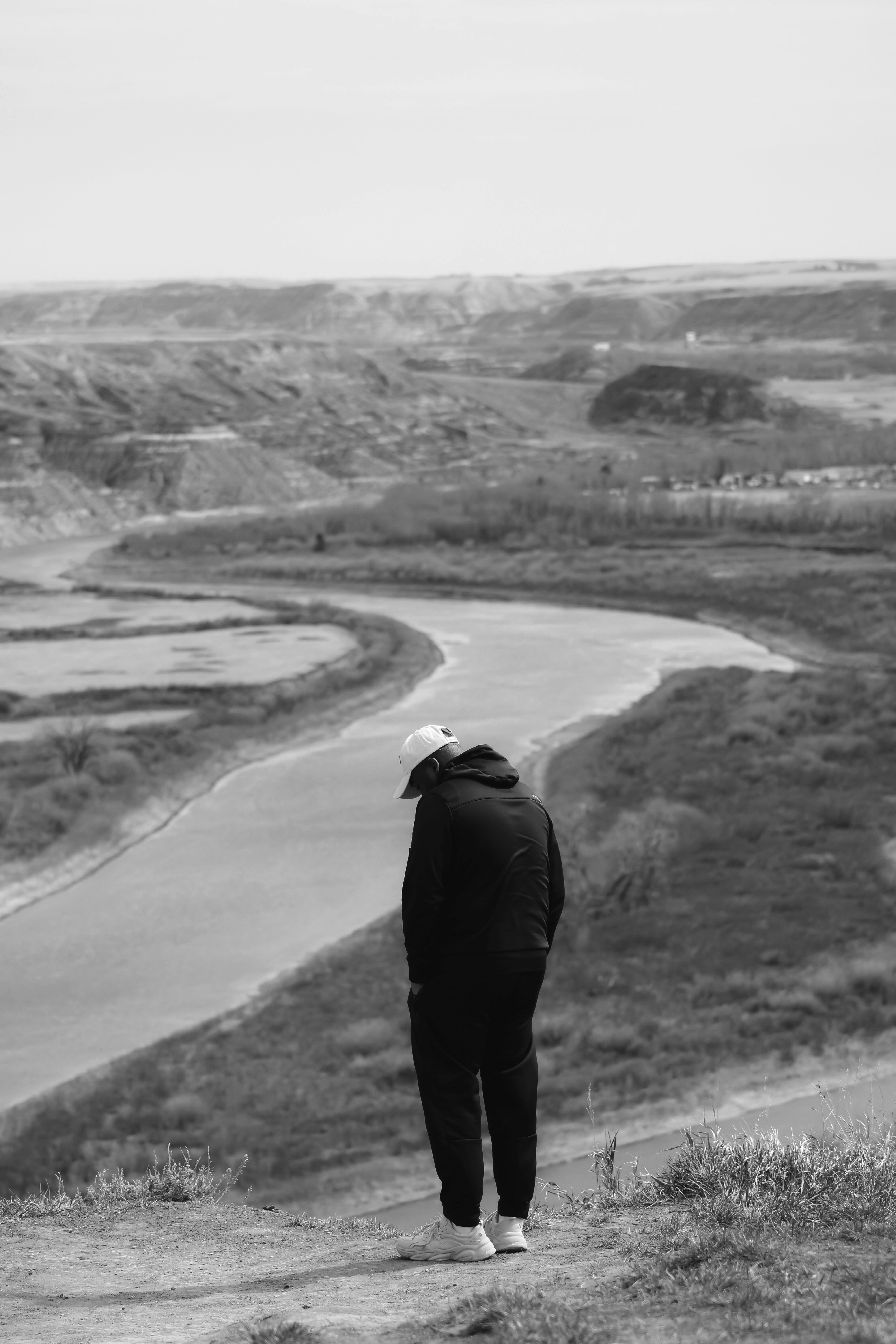 Solitary Wanderer at the Bend: A Quiet Descent Along the River