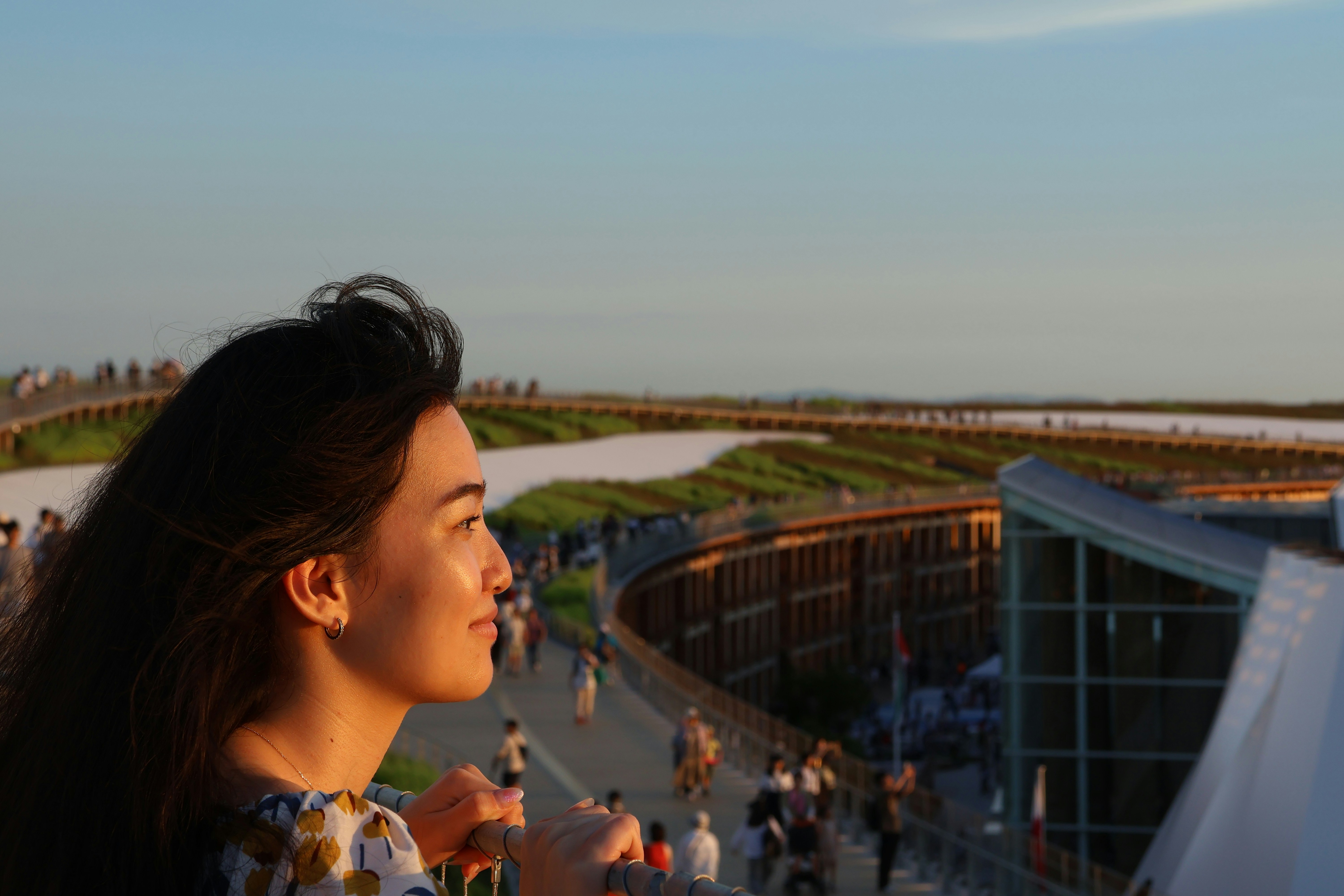 Rooftop Portrait: Calm Gaze Against a Modern Skyline