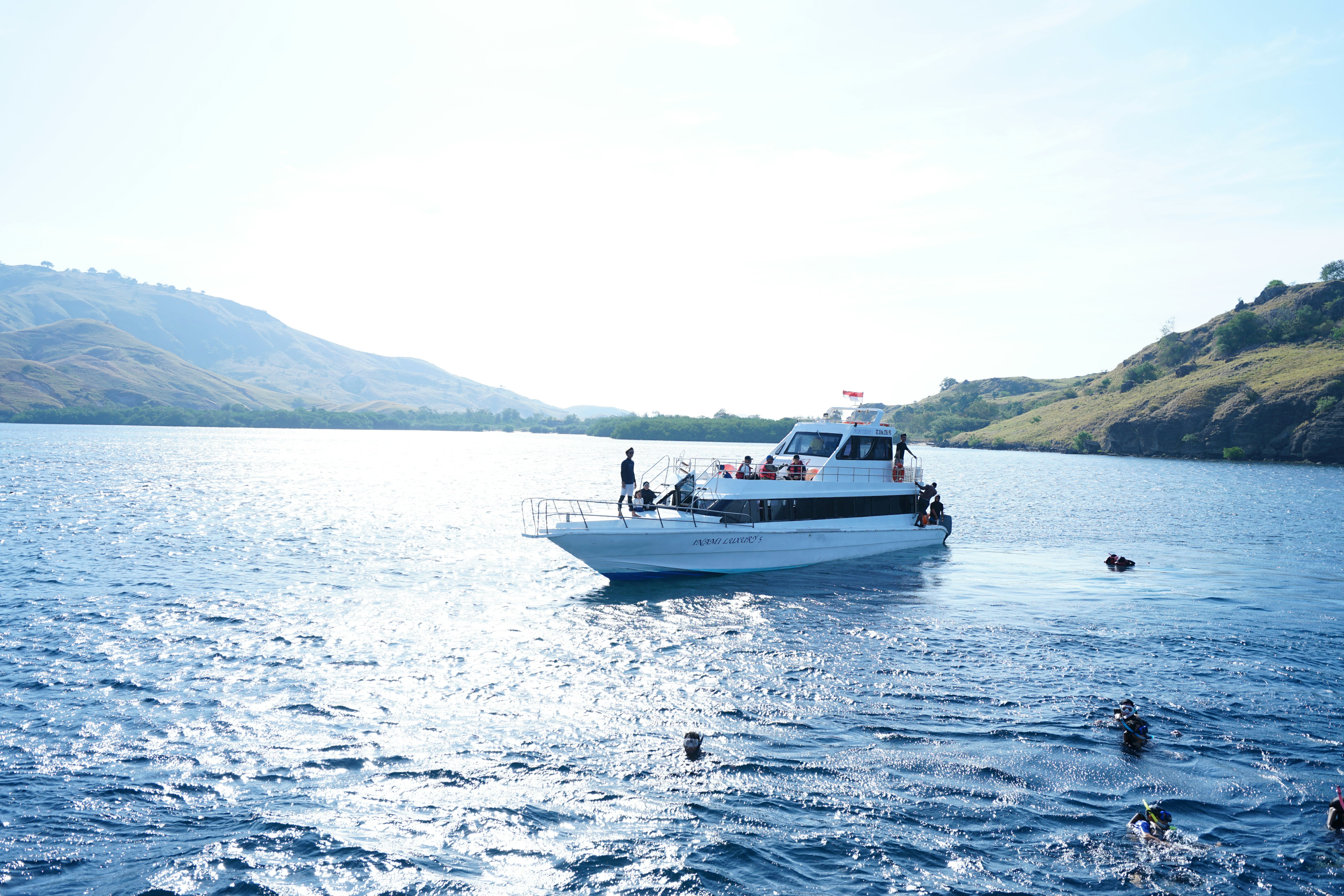 Silent Vessel Drifting Across Sunlit Waters