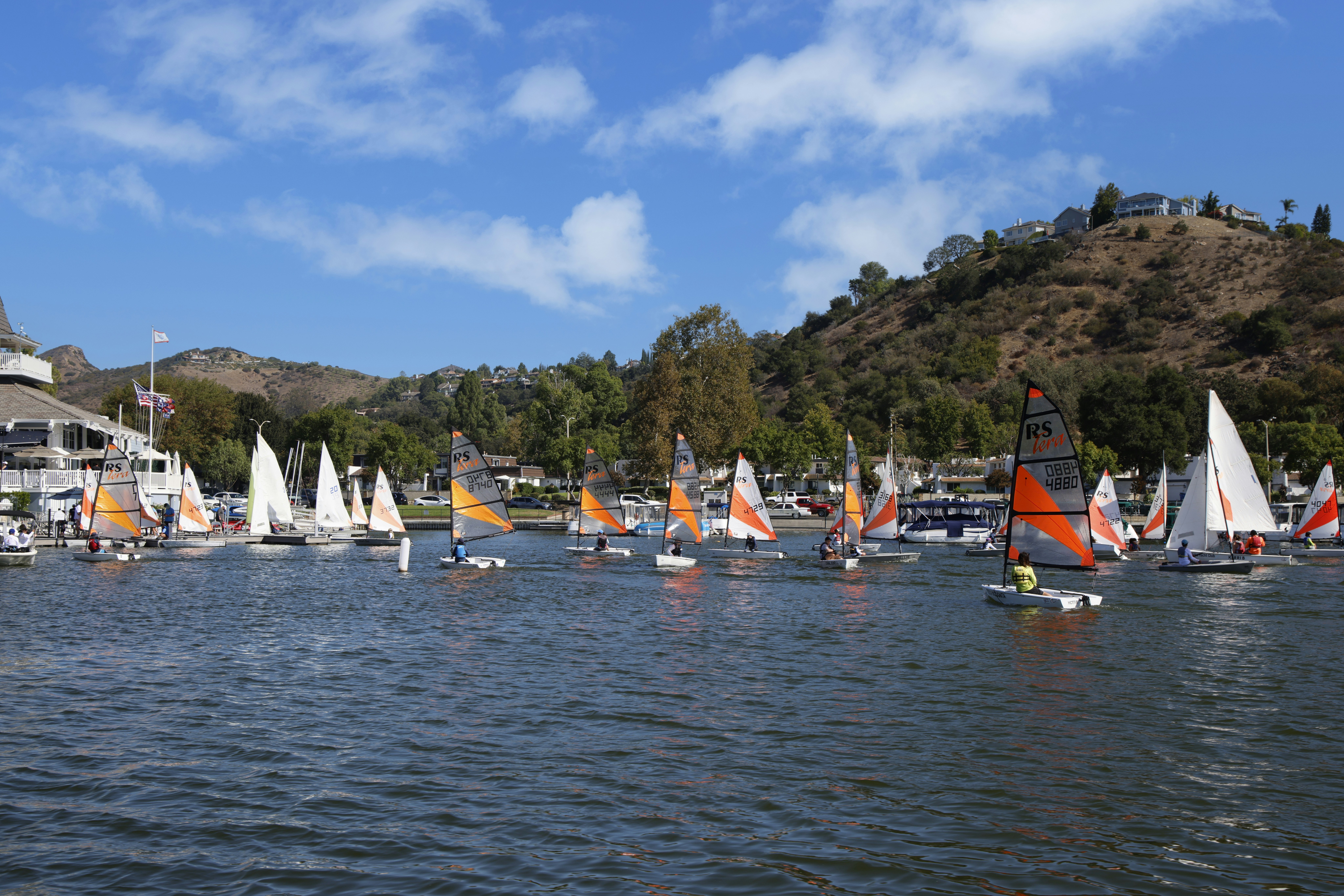 Sailboats Amid a Sparkling Lake Valley