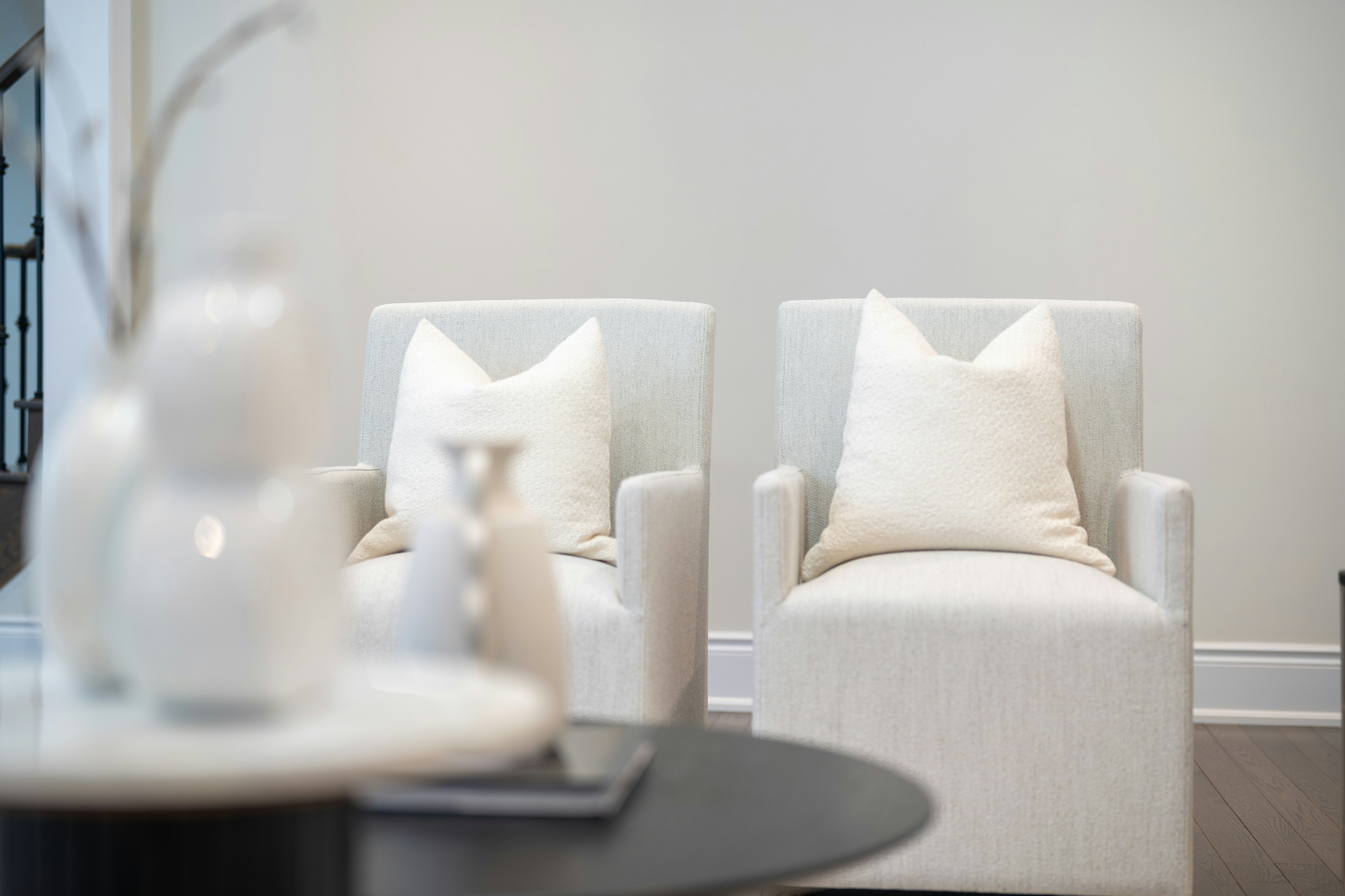 Minimalist Lounge: Cream Armchairs with Soft Cushions in Quiet Home