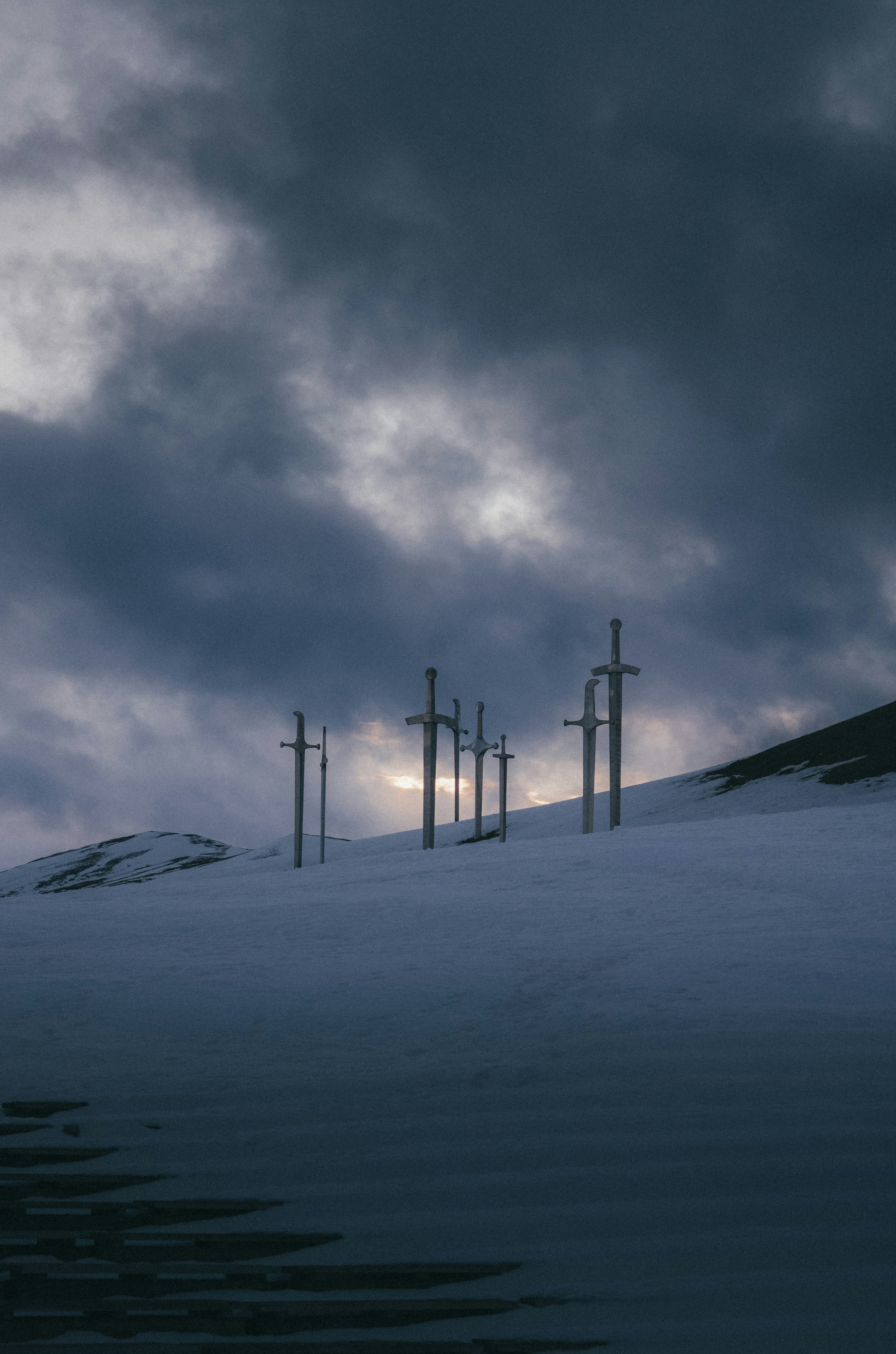Snowfield Crossroads: A Row of Swords against a Stormy Sky