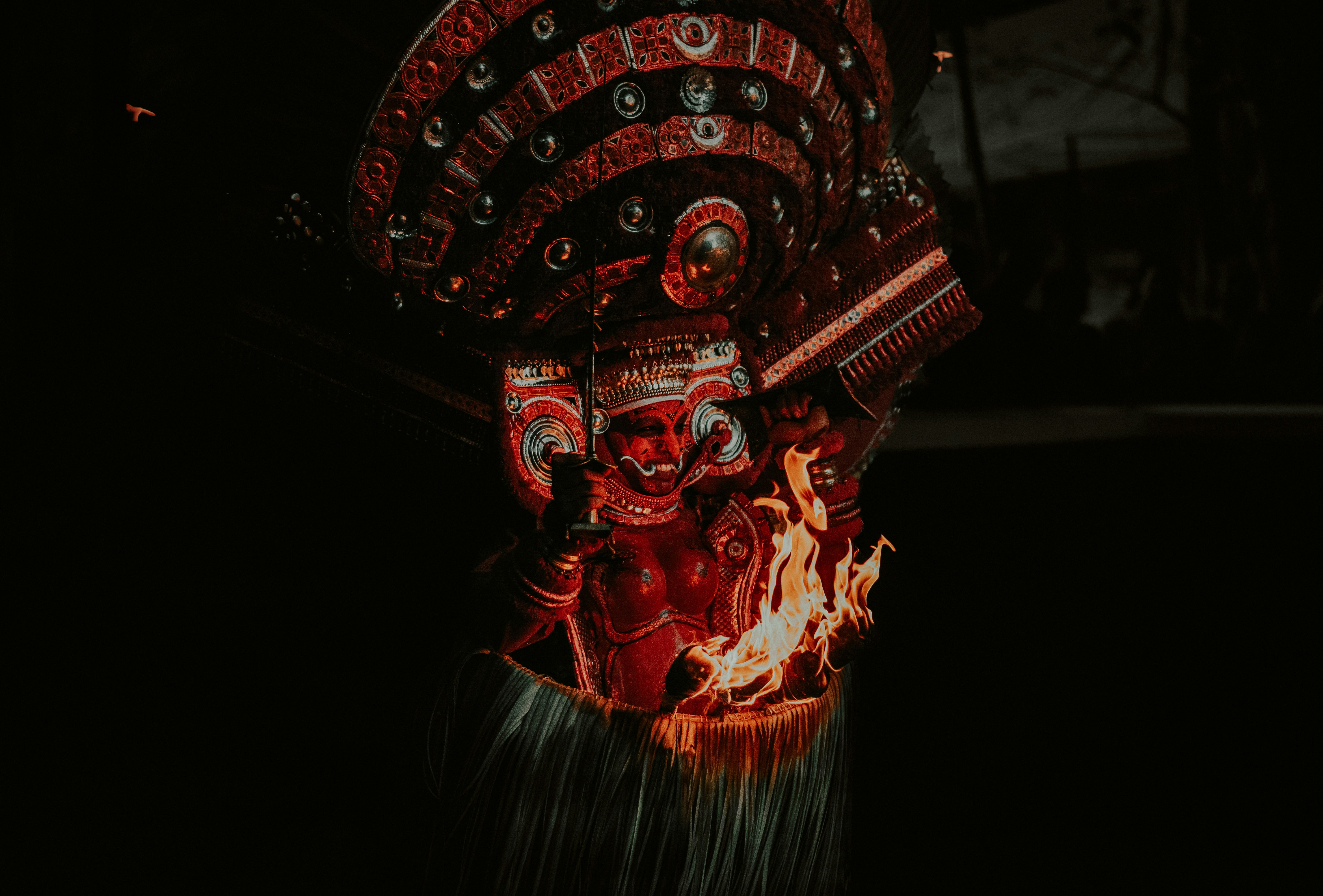 Flames and Adorned Headdress: A Dark Stage of Ritual Fire