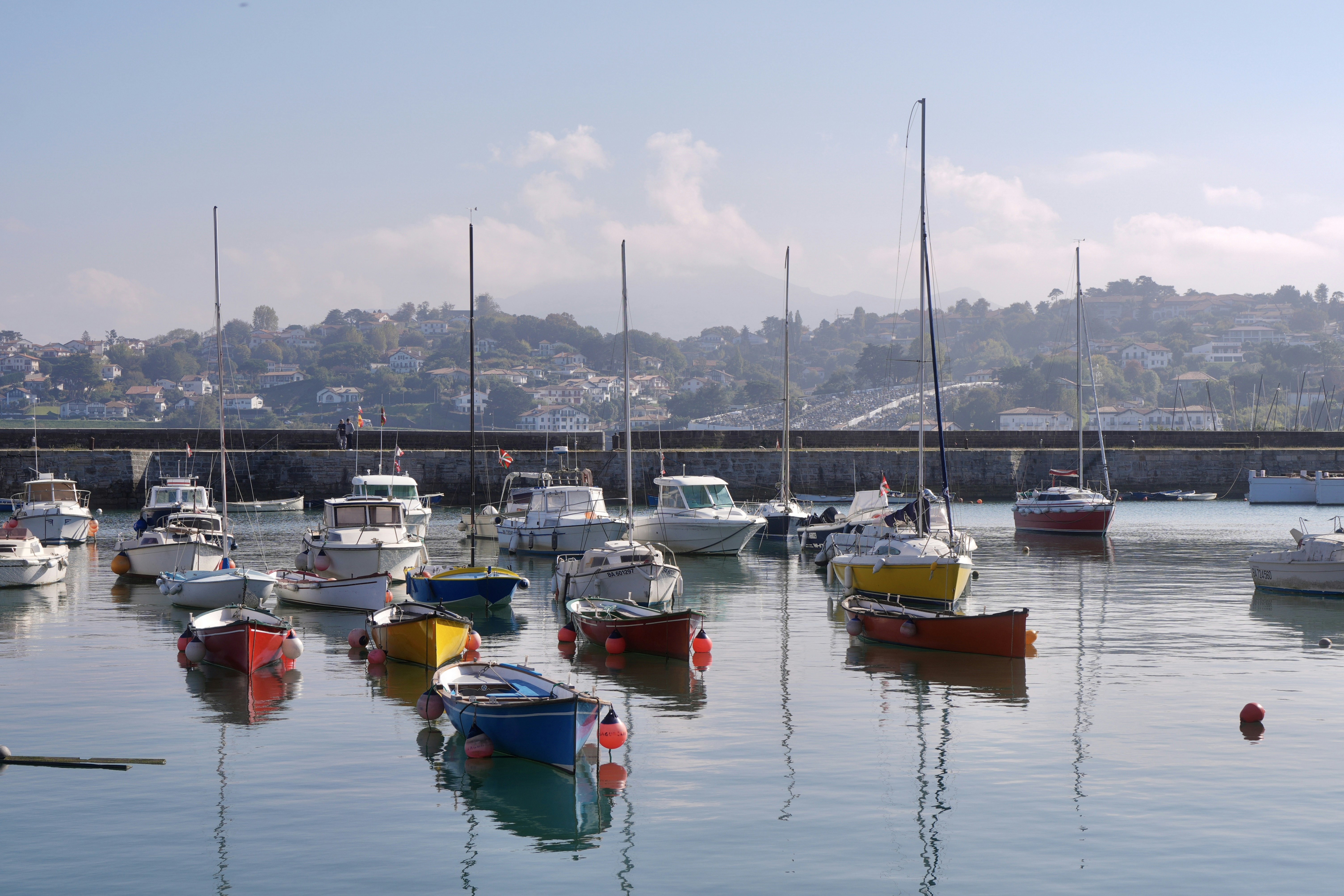 Colorful Boats at Rest Over a Calm Harbor