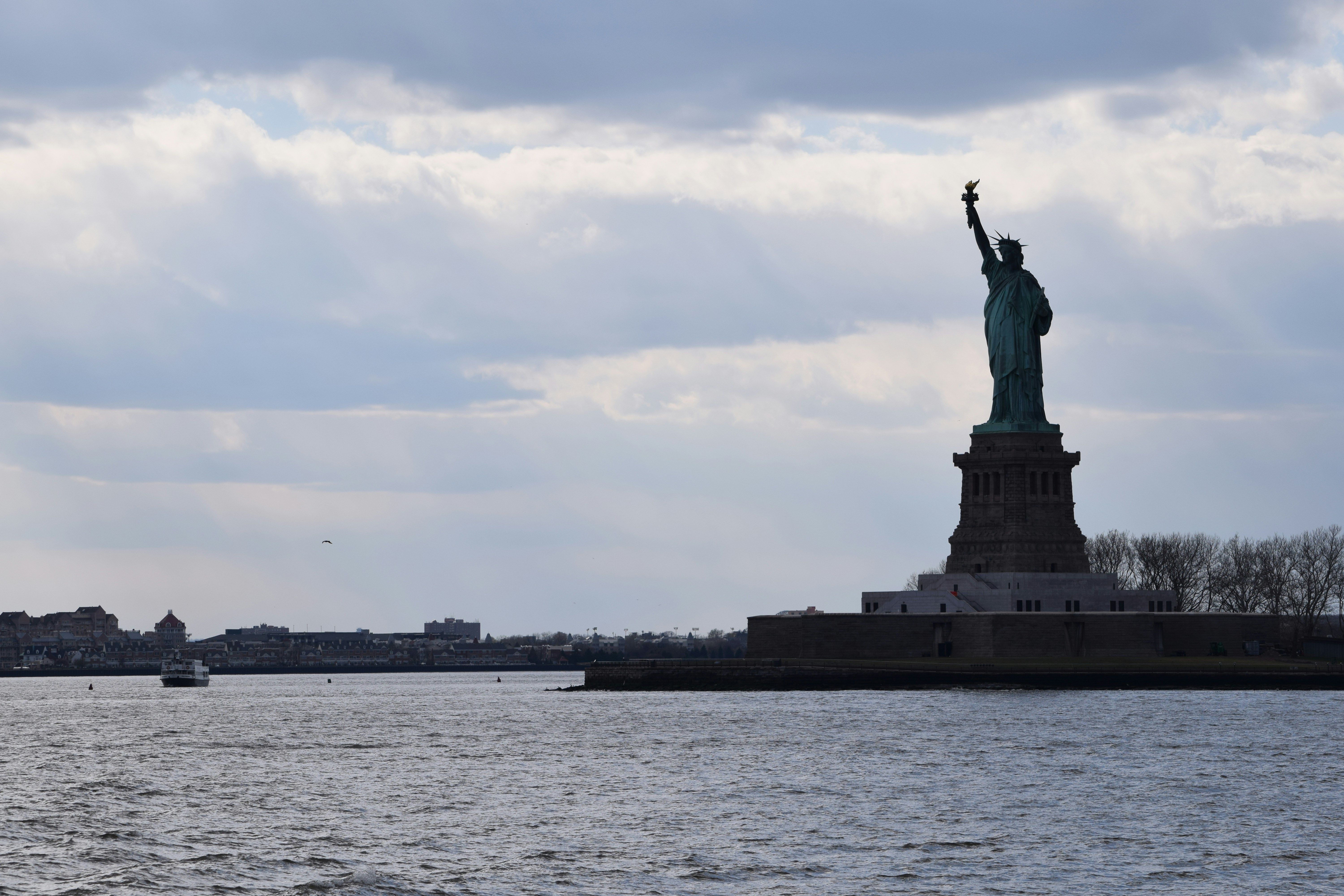 Statue of Liberty on the Horizon: Silent Waterfront Moment