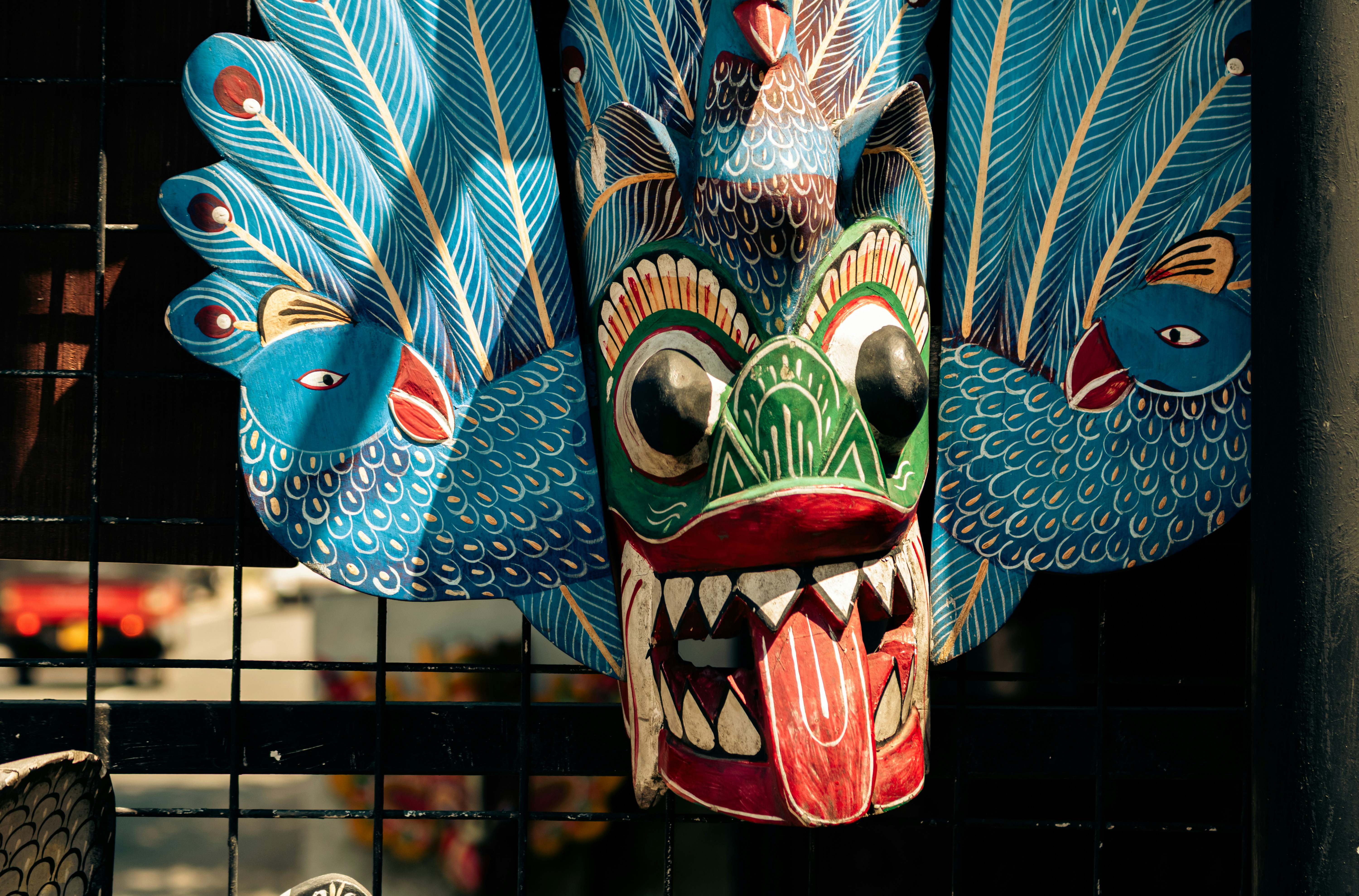 Colorful Dragon Mask Stare Across the Fence