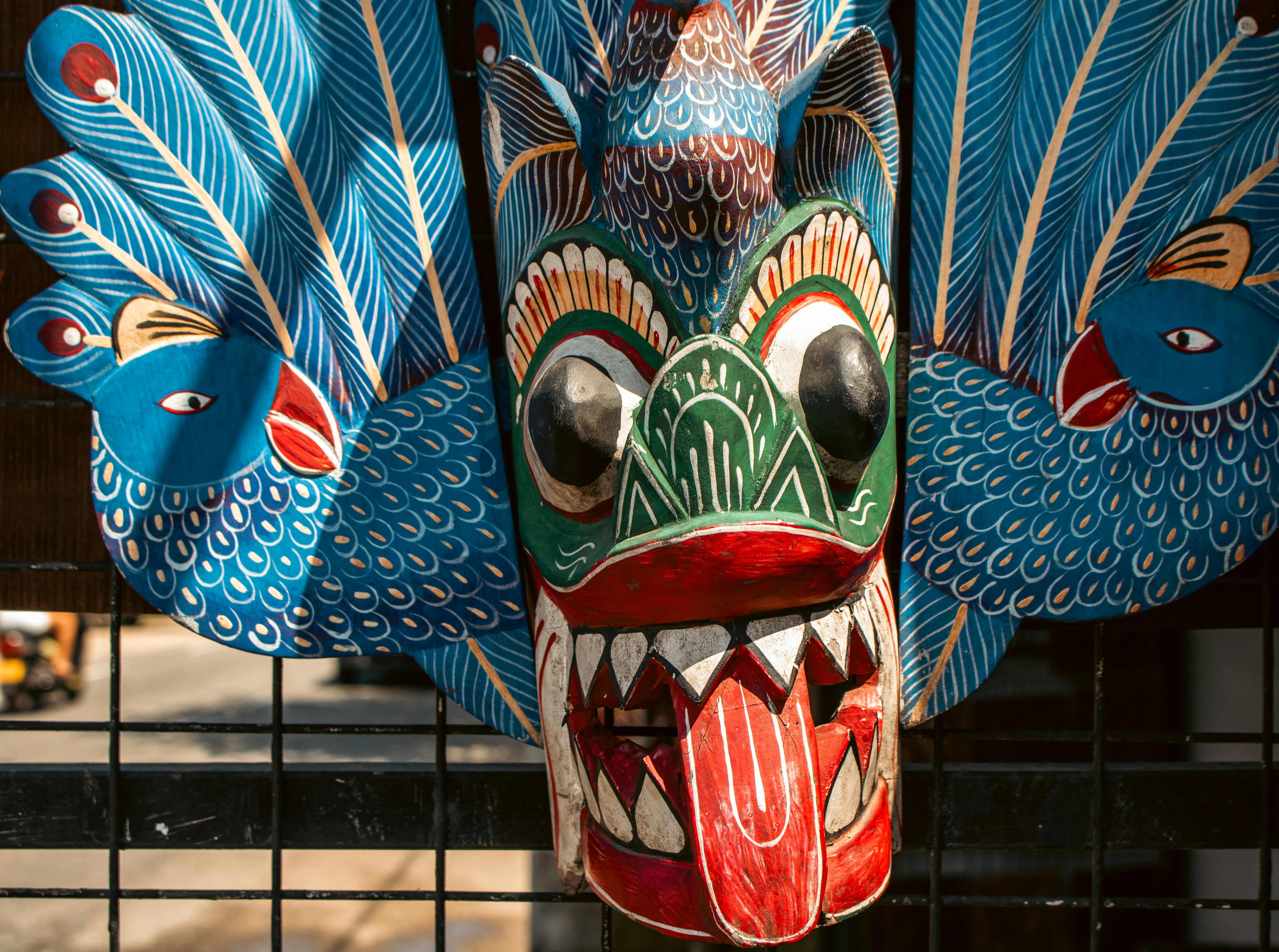 Color-Splashed Dragon Mask with Luminous Eyes and Grinning Teeth