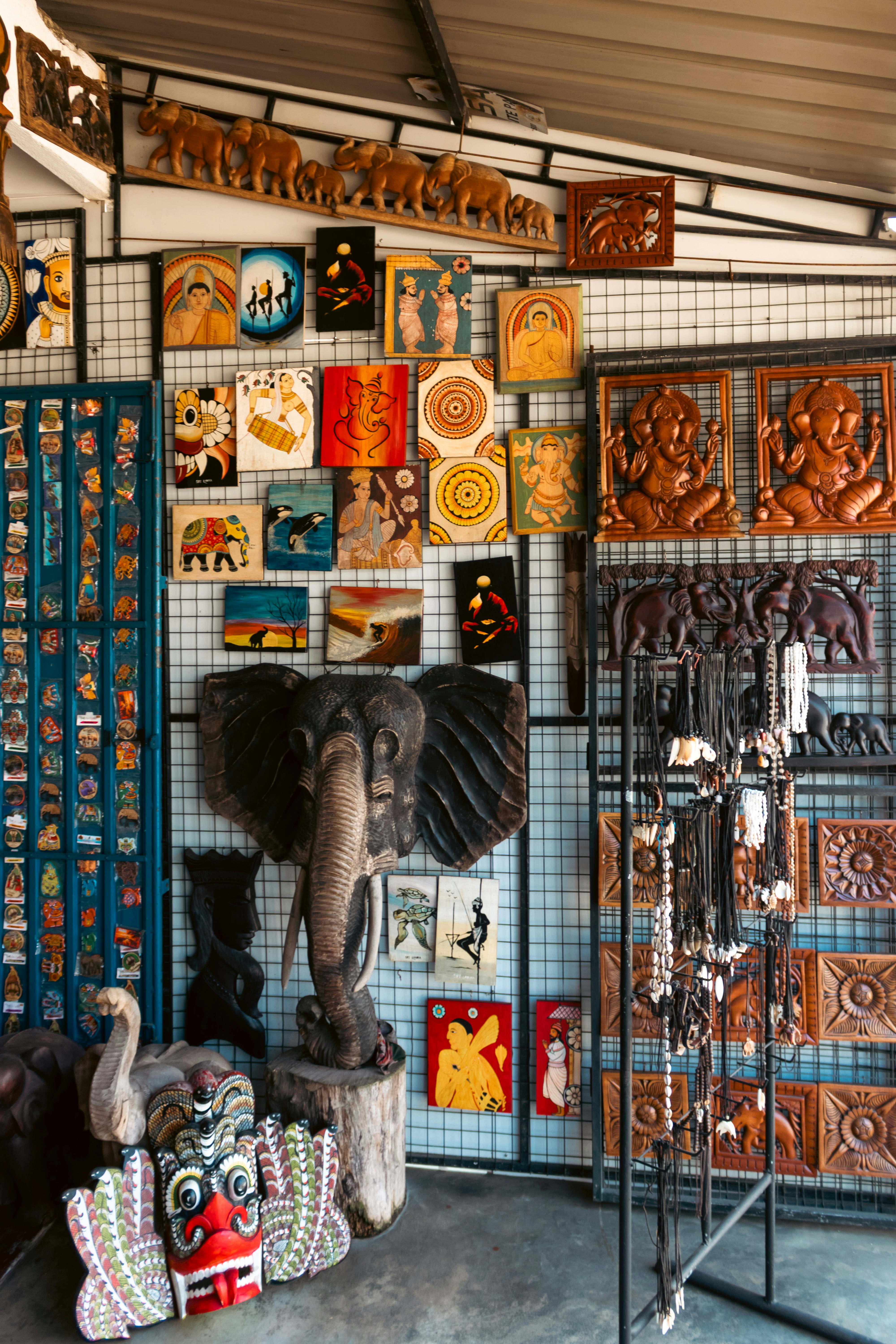 Colorful Market Wall of Carvings: A Dense Gallery of Art and Elephants