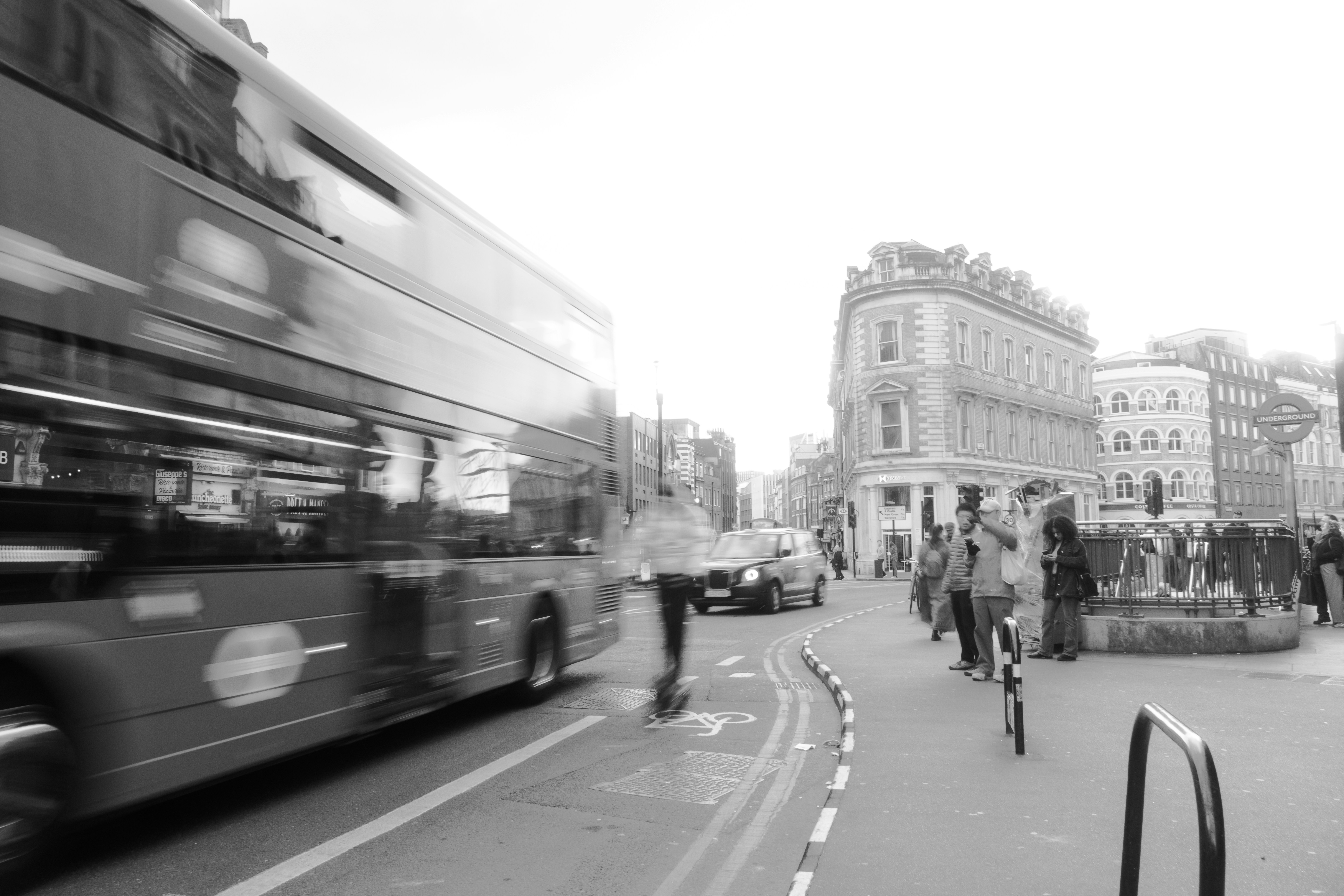 Motion at the Corner: A Busy Street with a Blurred Bus