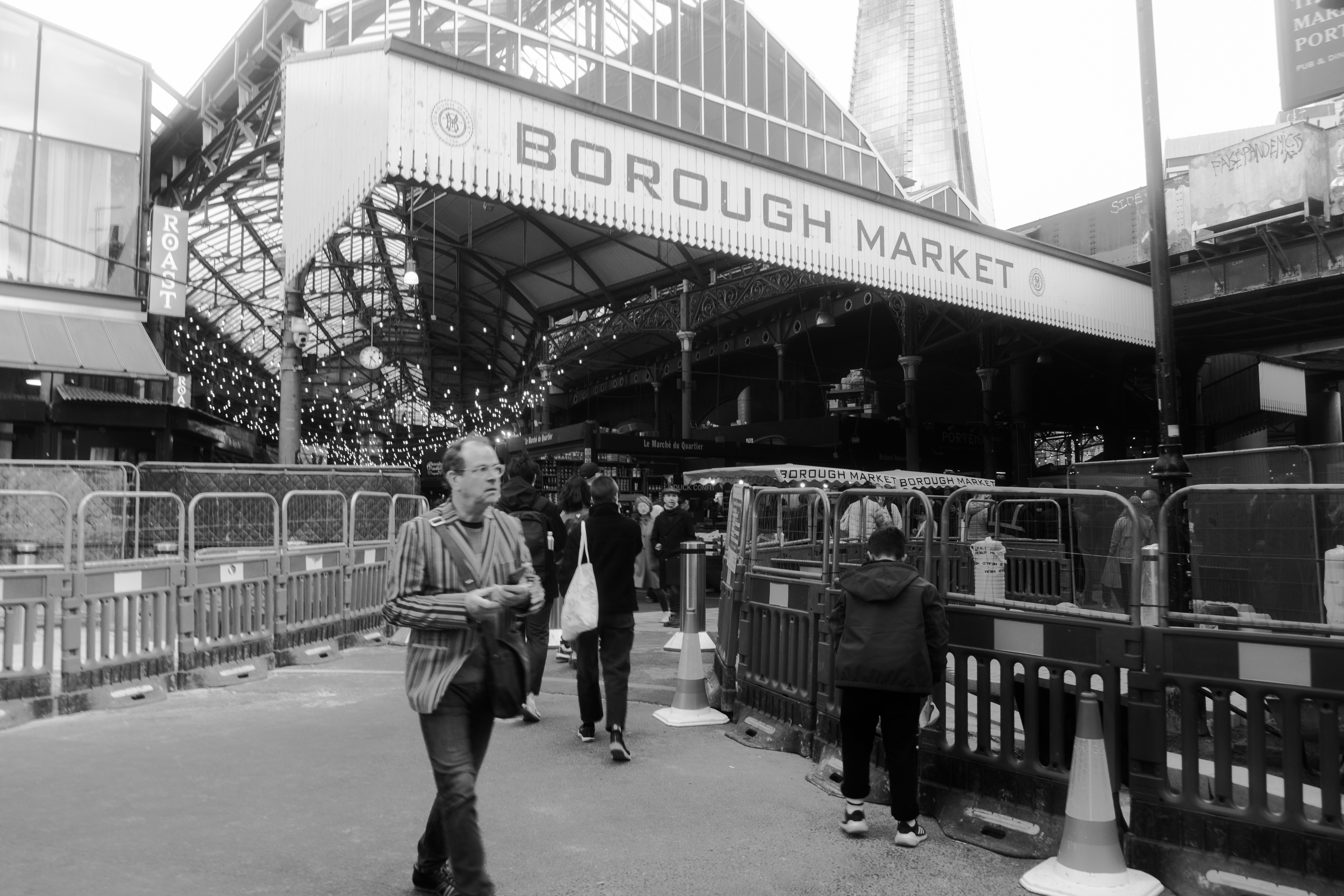 Urban Crossing Beneath Borough Market Sign
