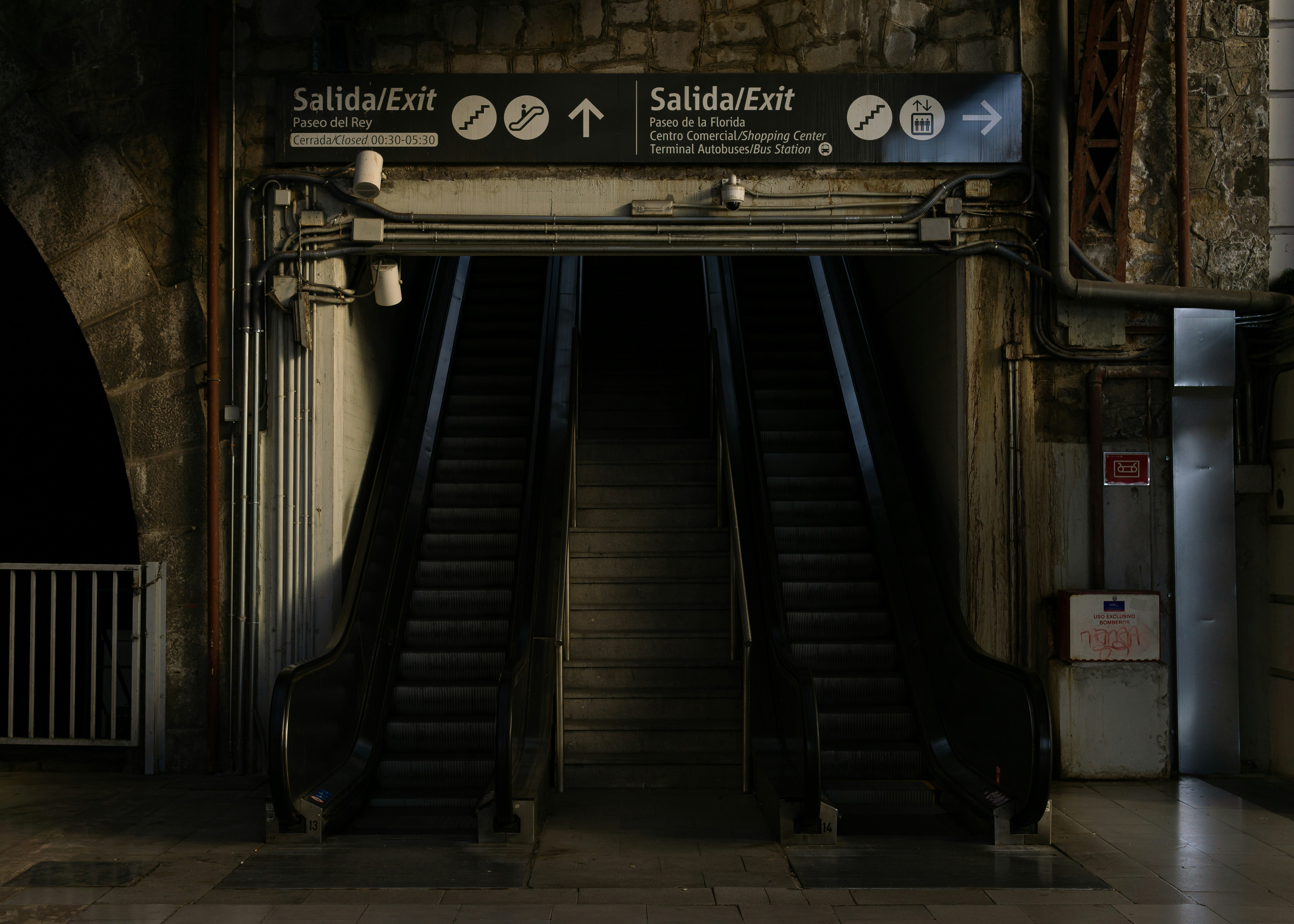 Midnight Descent: Escalator into the Dim Underground