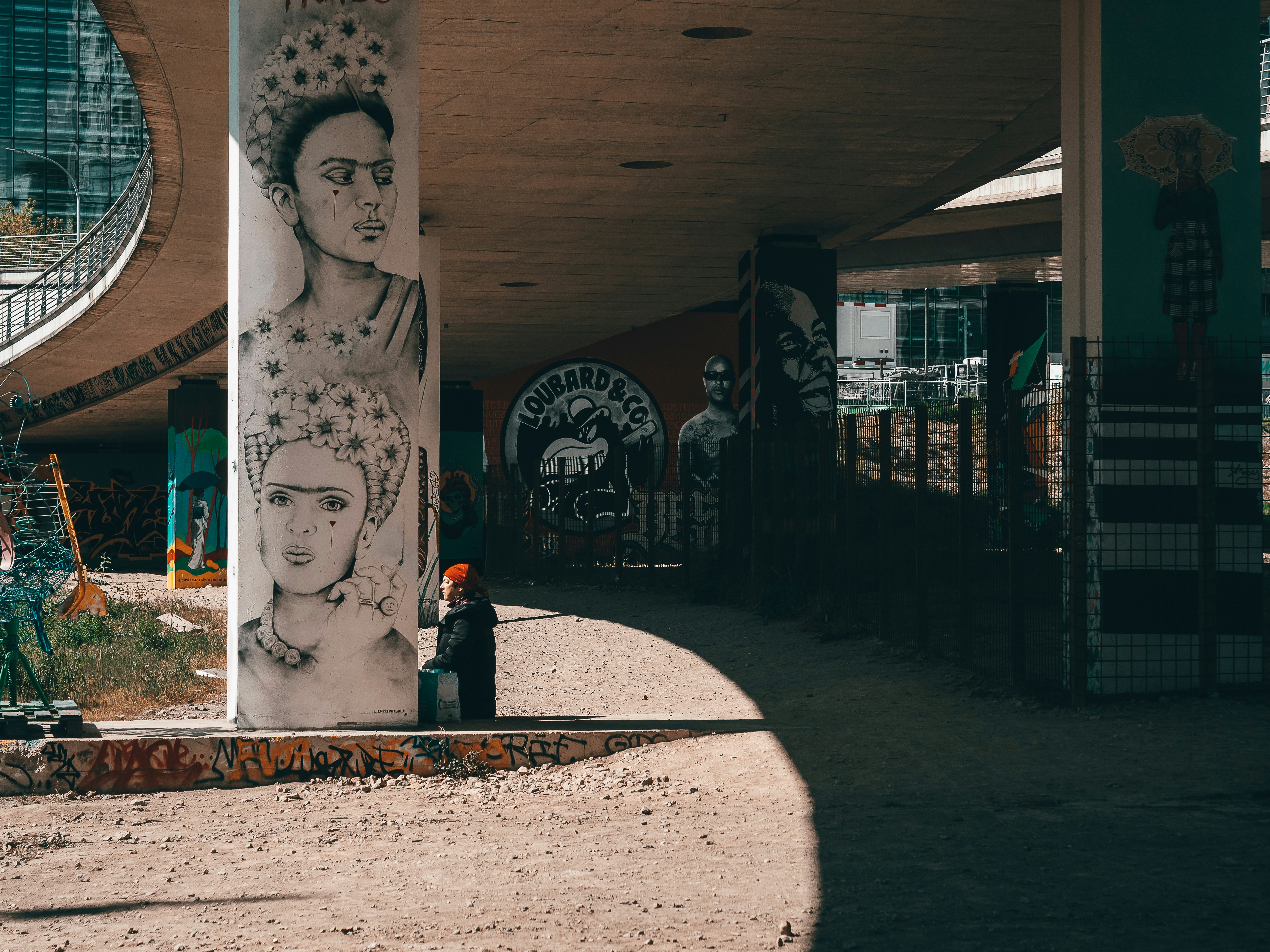 Graffiti Arc: Shade, Figures, and Light Under the Overpass