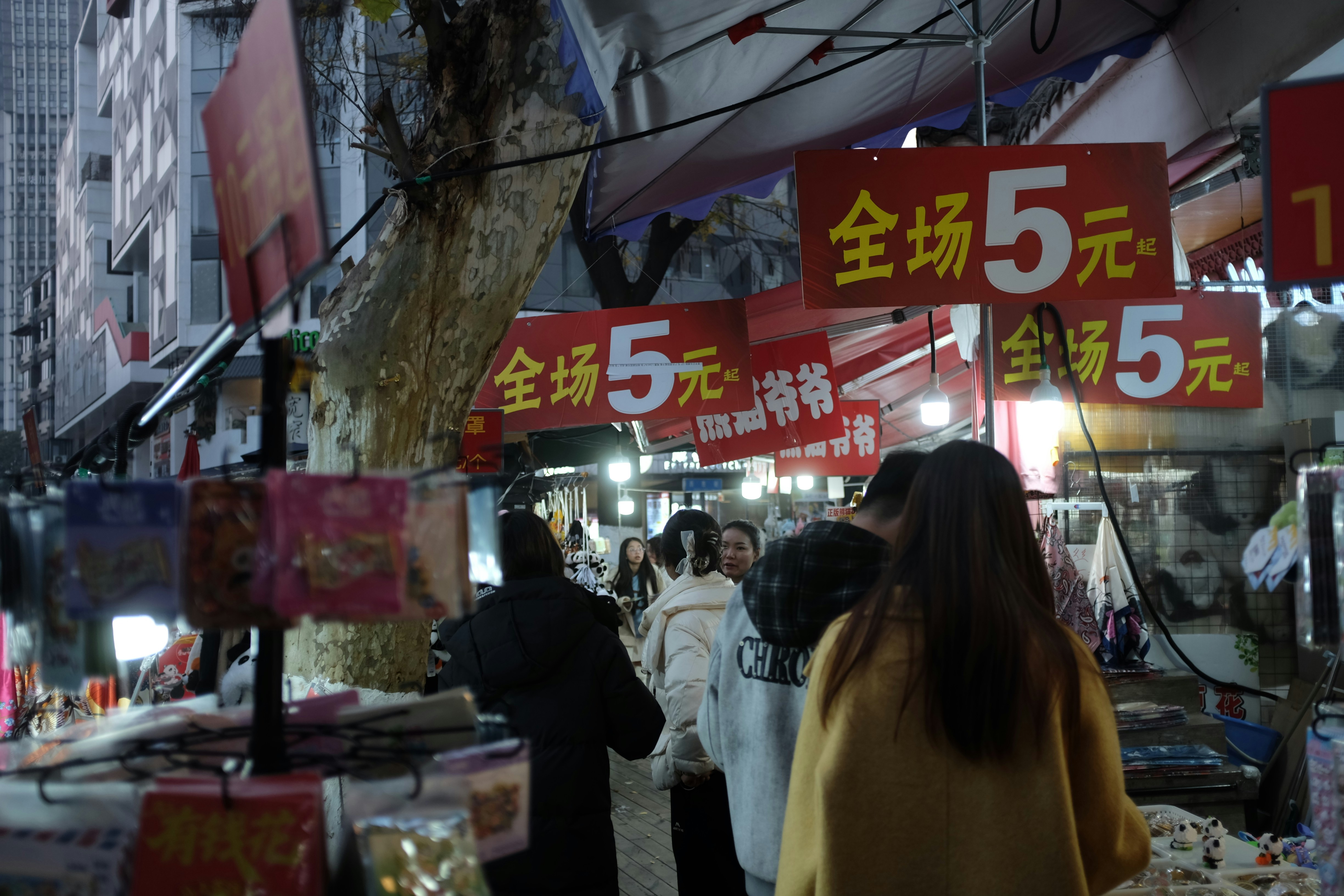 Marketscape Portrait Under Neon Red Promos