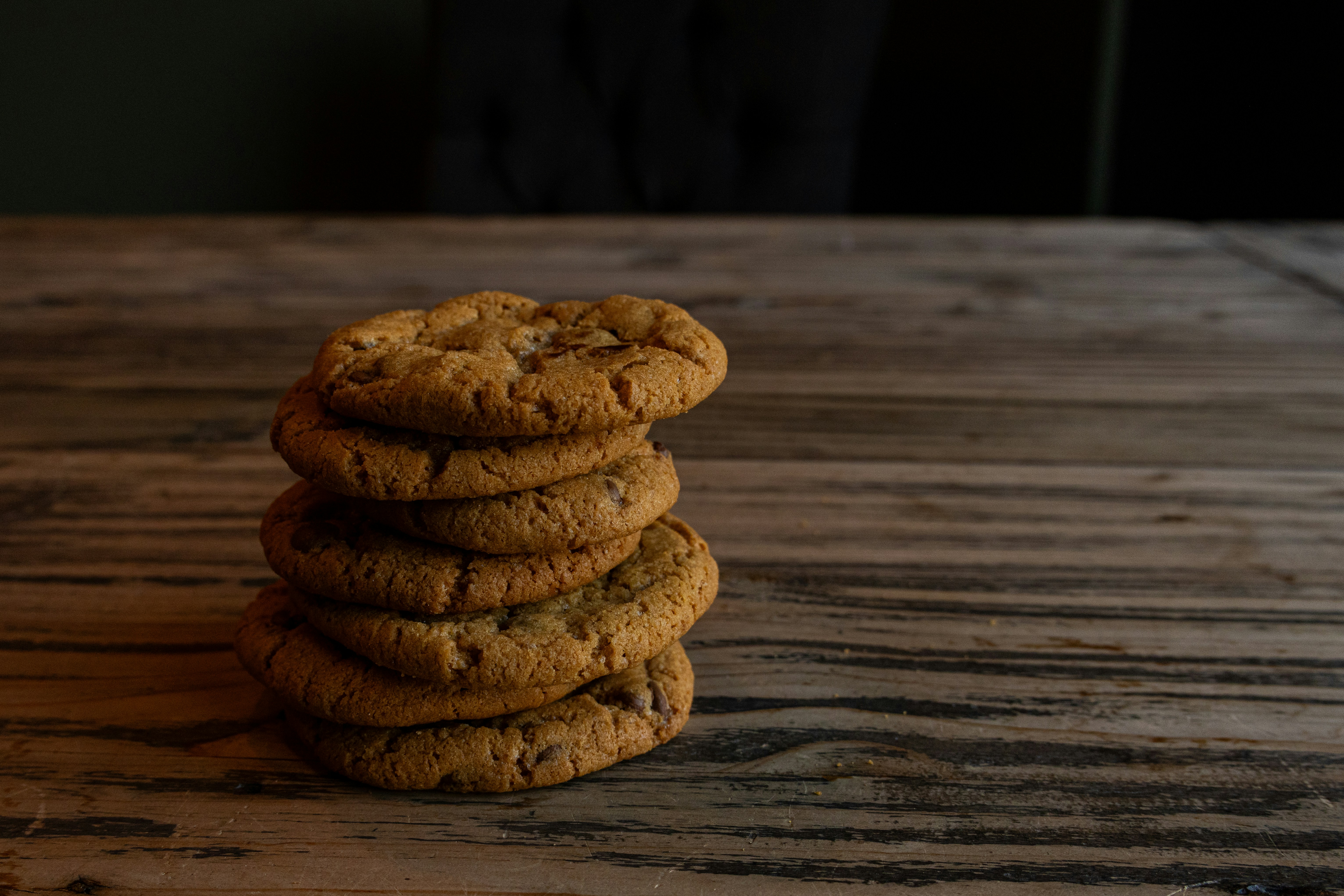 Stacked Warmth: A Quiet Still Life of Cookies on Wood