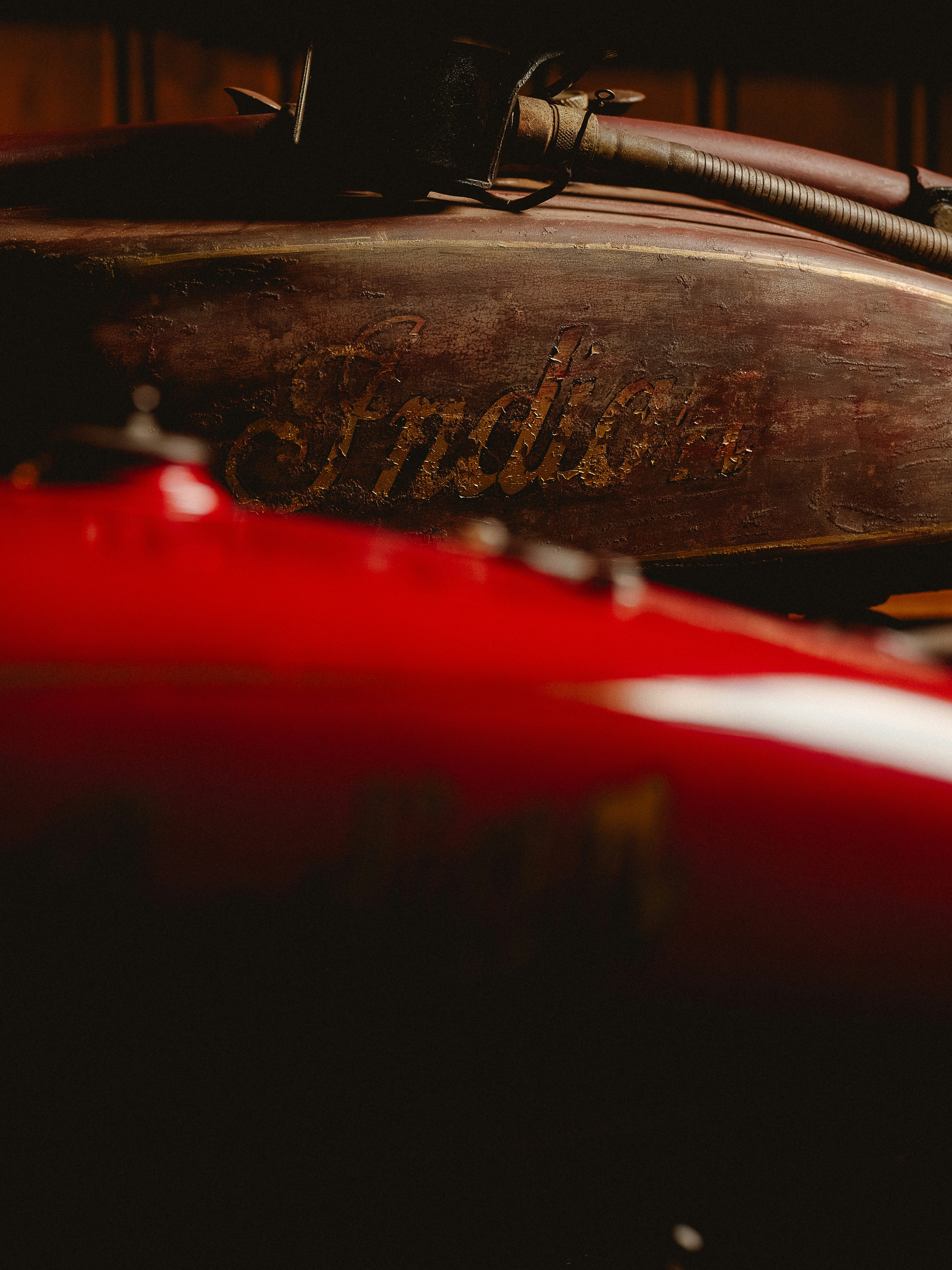 Resting Engine: A Glimpse of Vintage Craft Under Red Gloss
