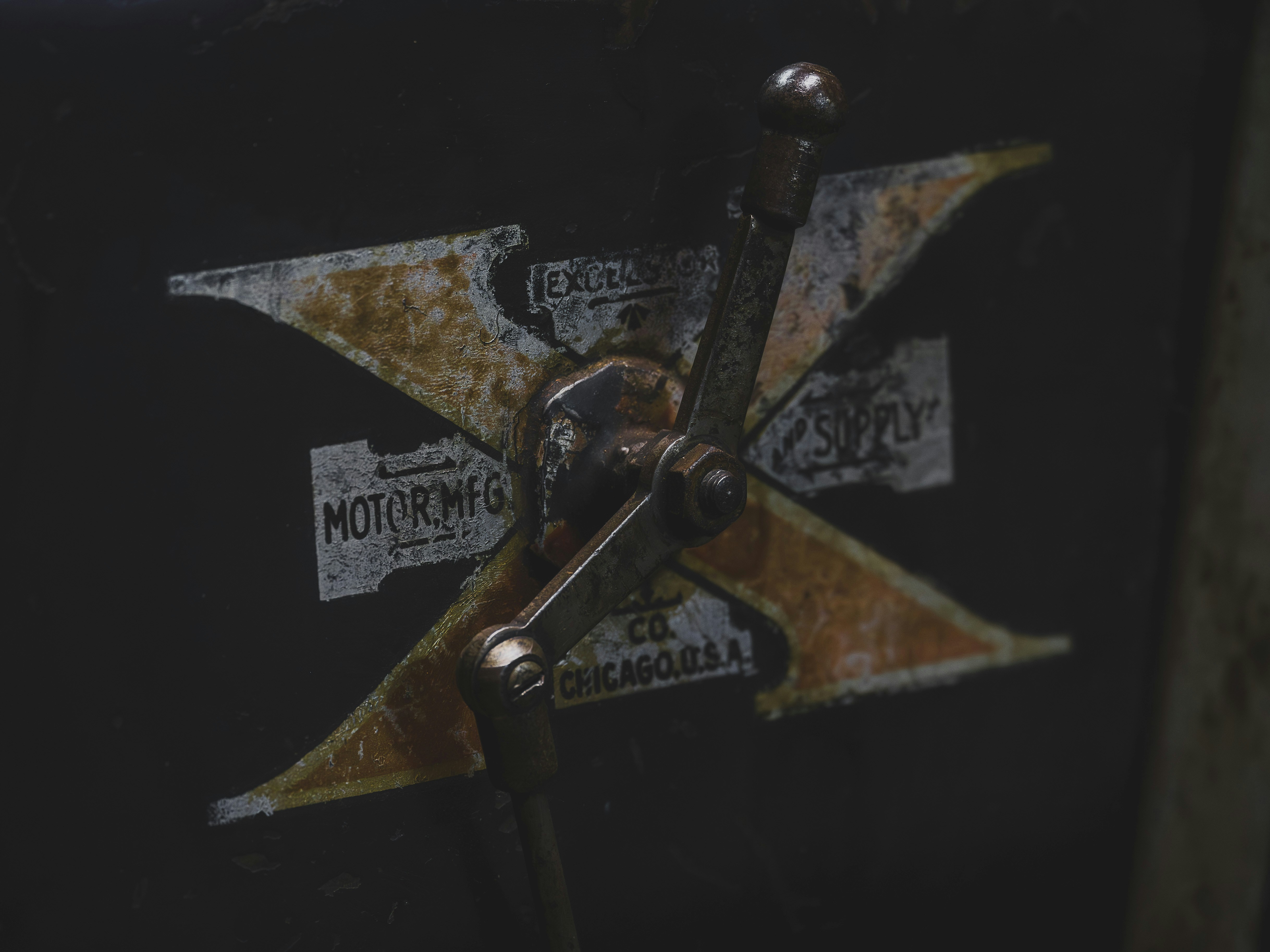 Rust and Relay: The Weathered X Emblem on a Vintage Mechanical Dial