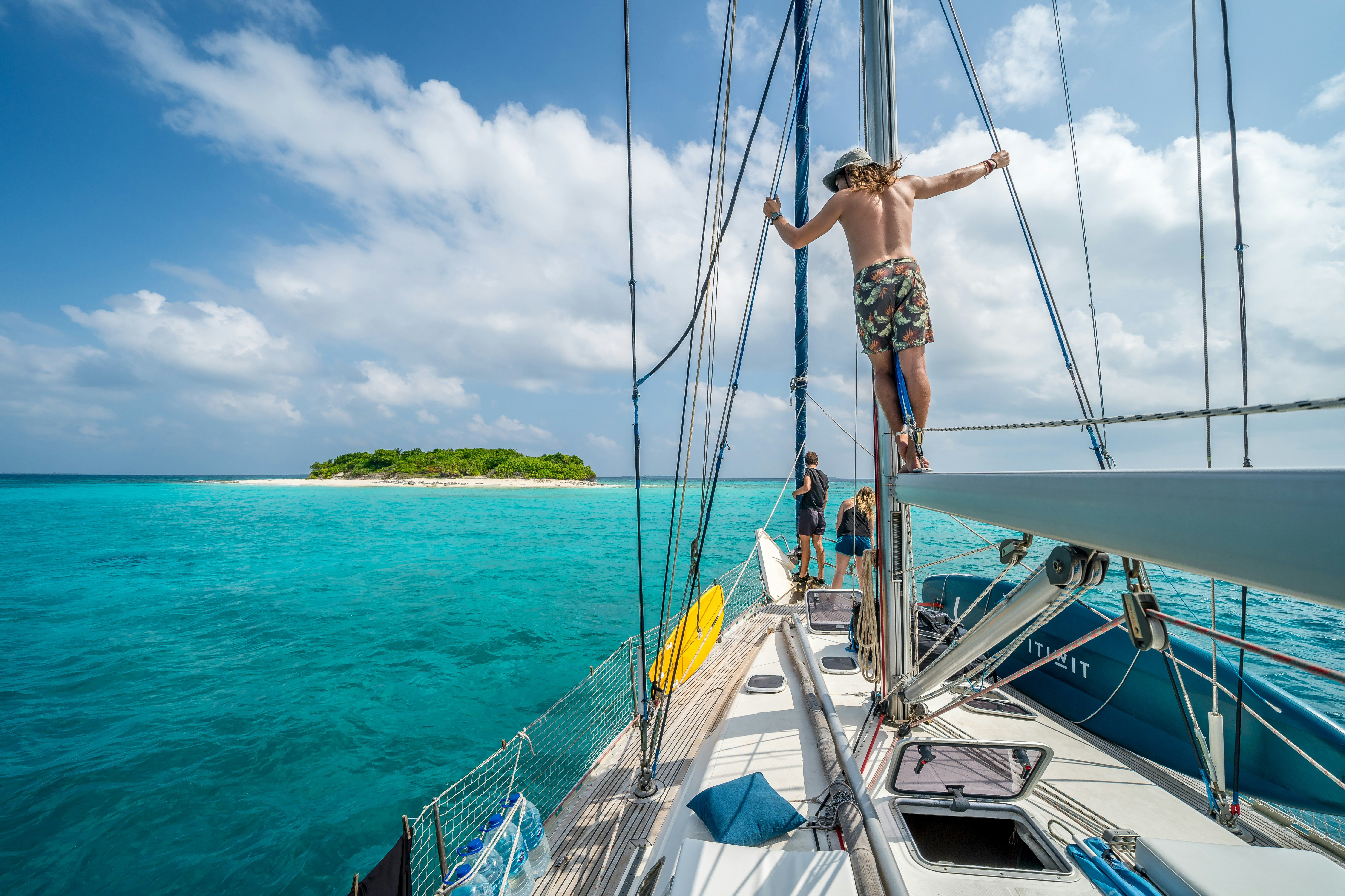 Sailor Climbing Aboard: A Sunlit Caribbean Crossing