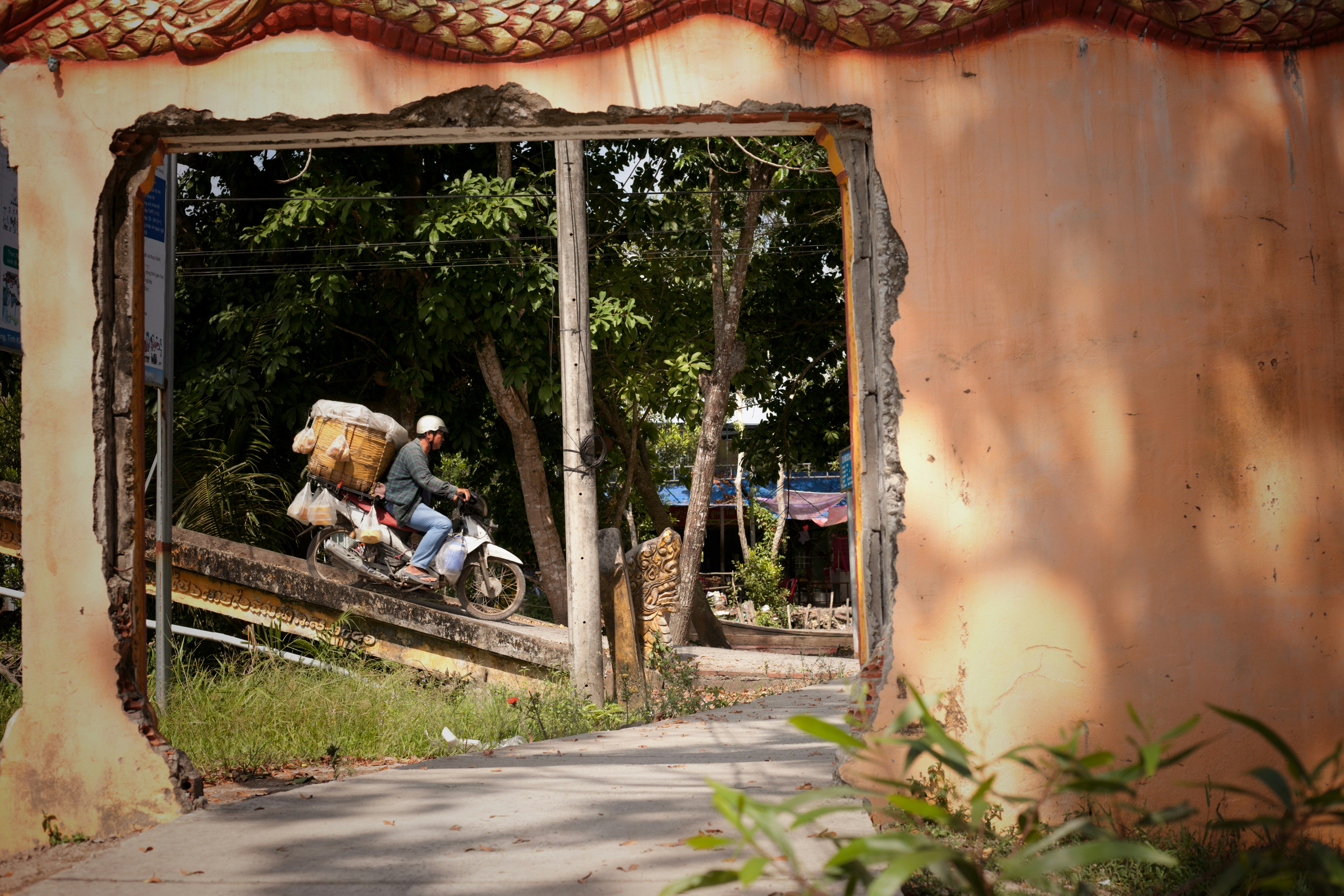 Motorcycle Journey Through the Framed Arch