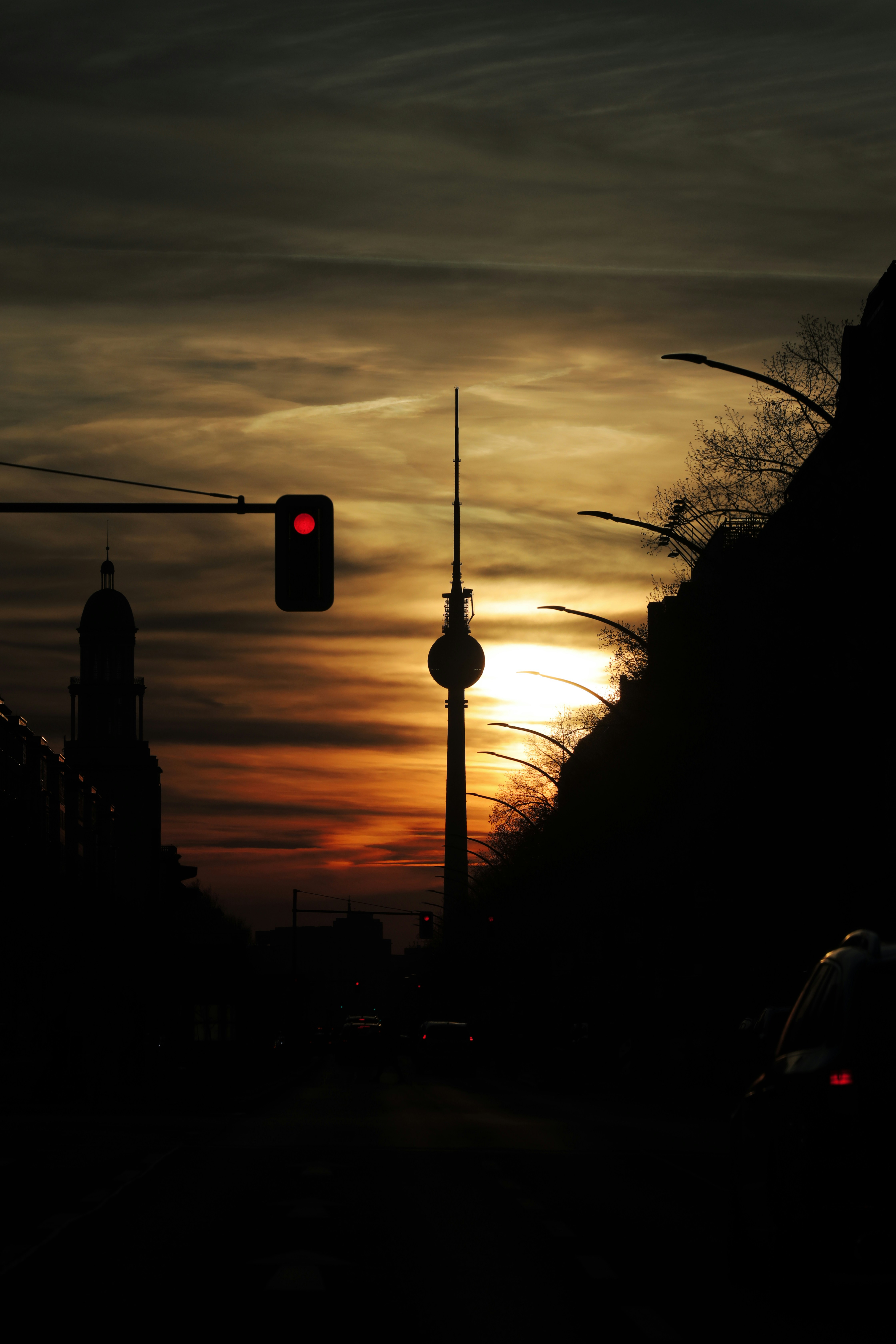 Silhouette at Sunset: The City’s Spire Against a Velvet Sky