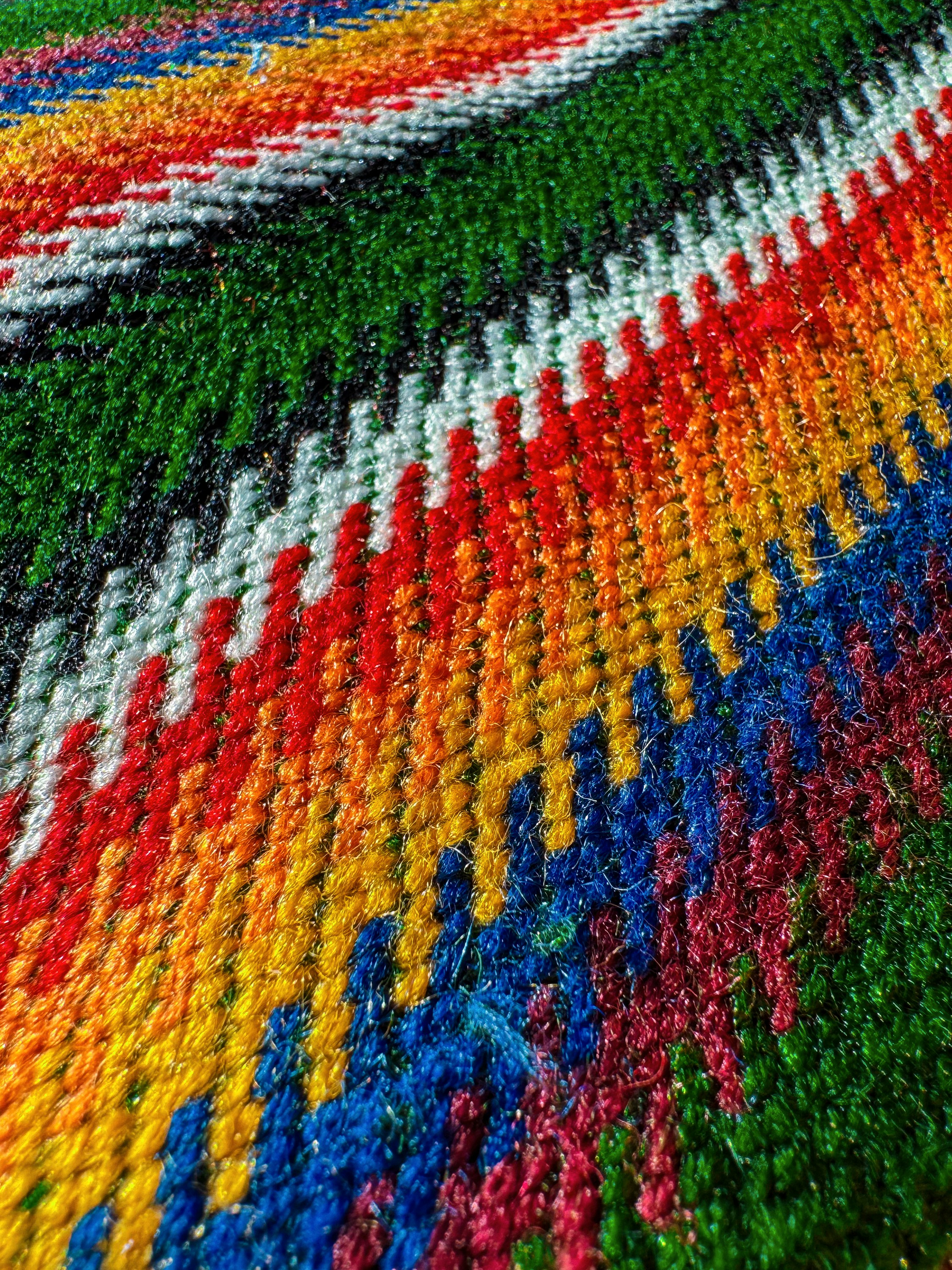 Diagonal Rainbow Weave: Close-Up of a Multicolored Textile Pattern