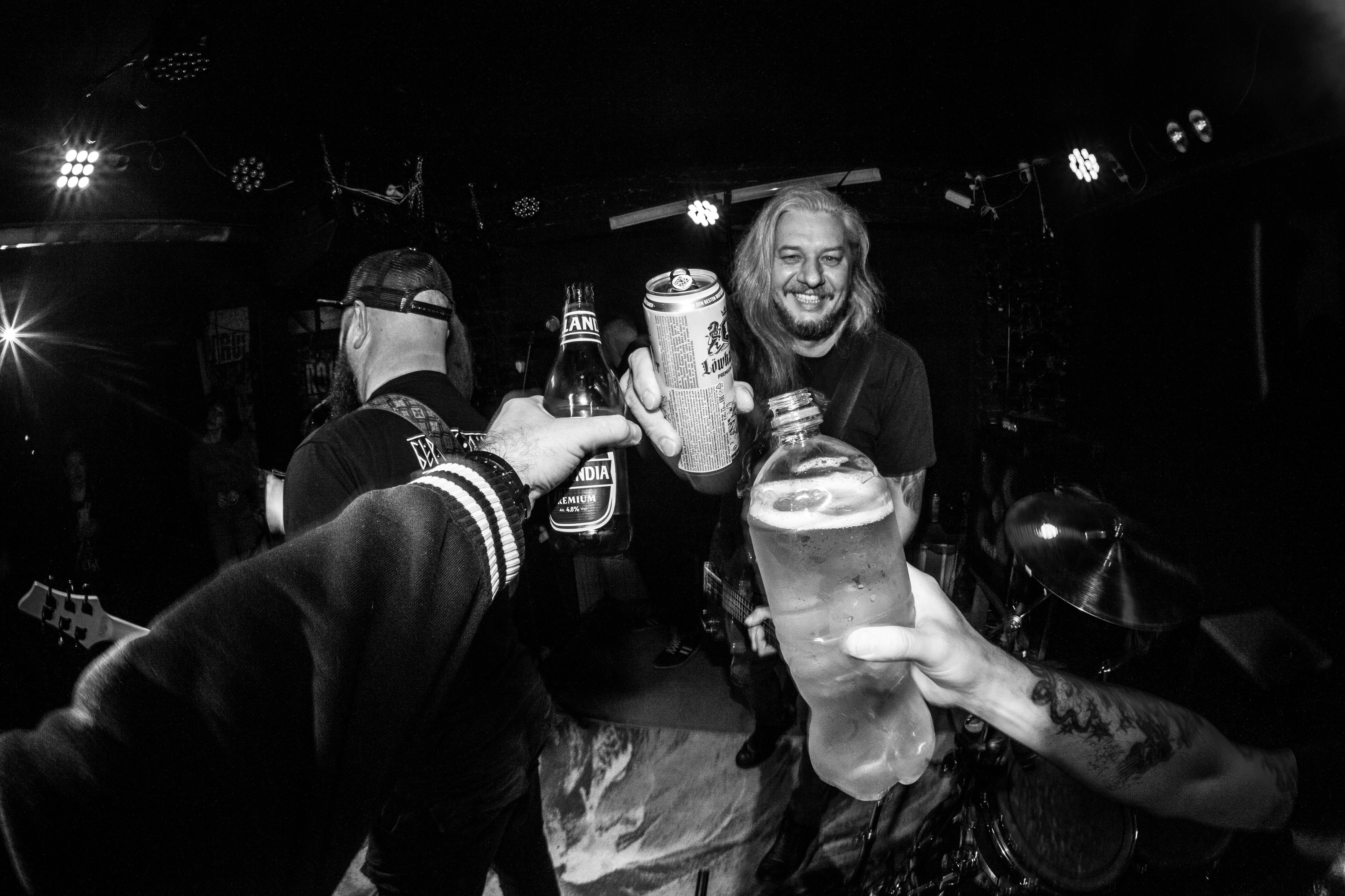 Cheers at the Front: A Grainy Night of Raised Glasses