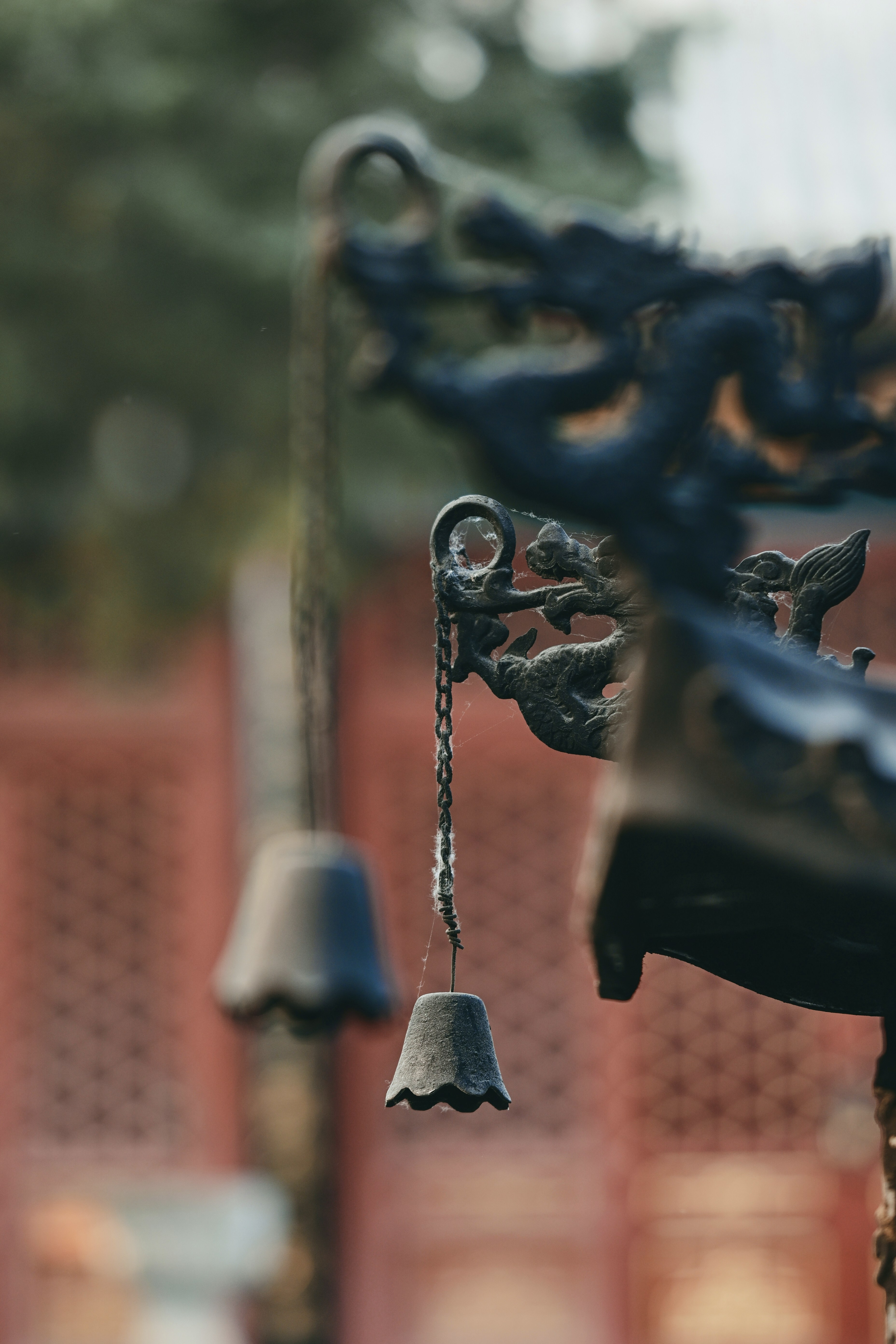 Dangling Bell Tinkers: Ornate Metalwork in Soft Focus