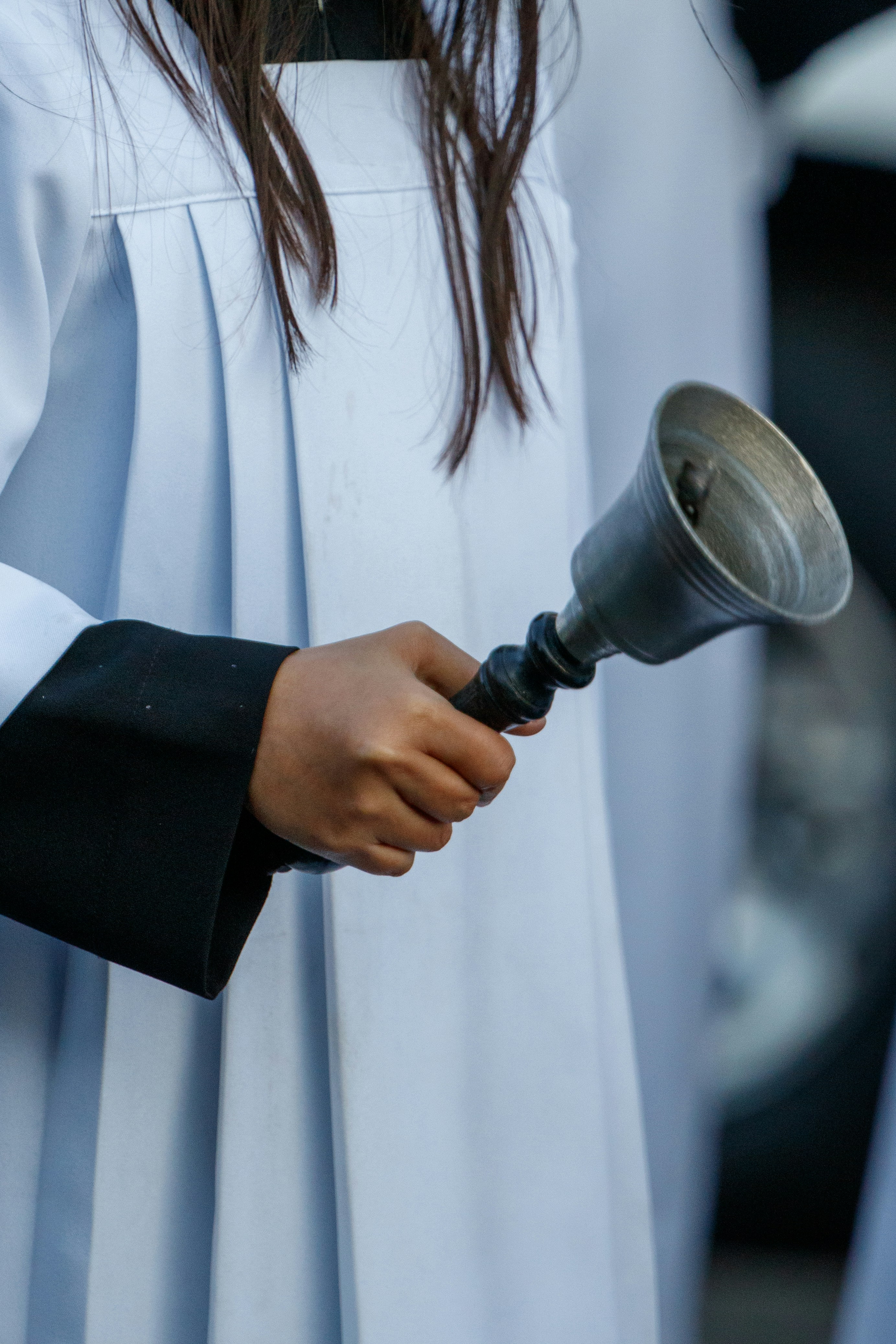 A Quiet Bell Ringer Grip: Clutch of the Hand in Ceremony Attire