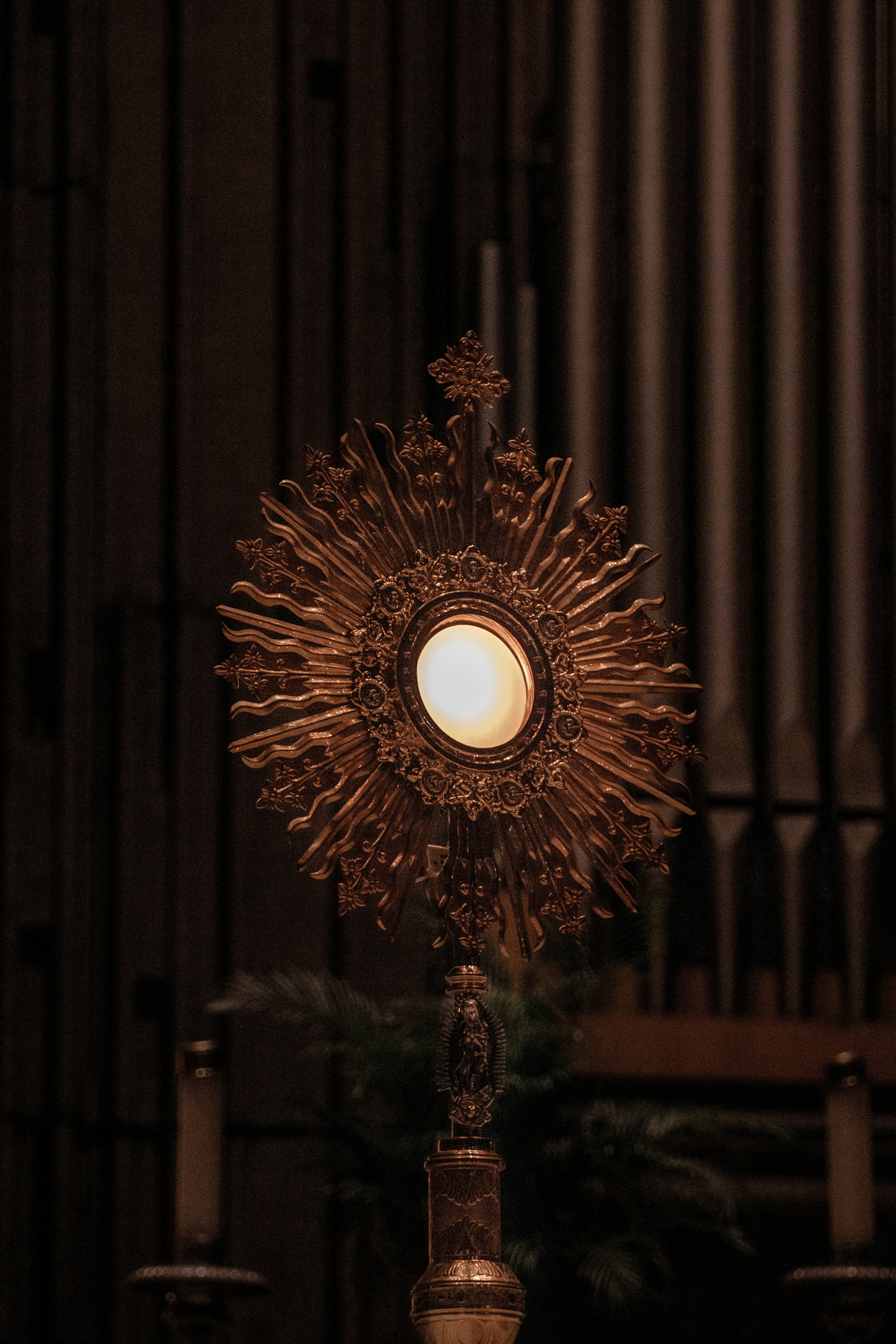 Radiant Monstrance: A Sacred Halo Under Dim Cathedral Light