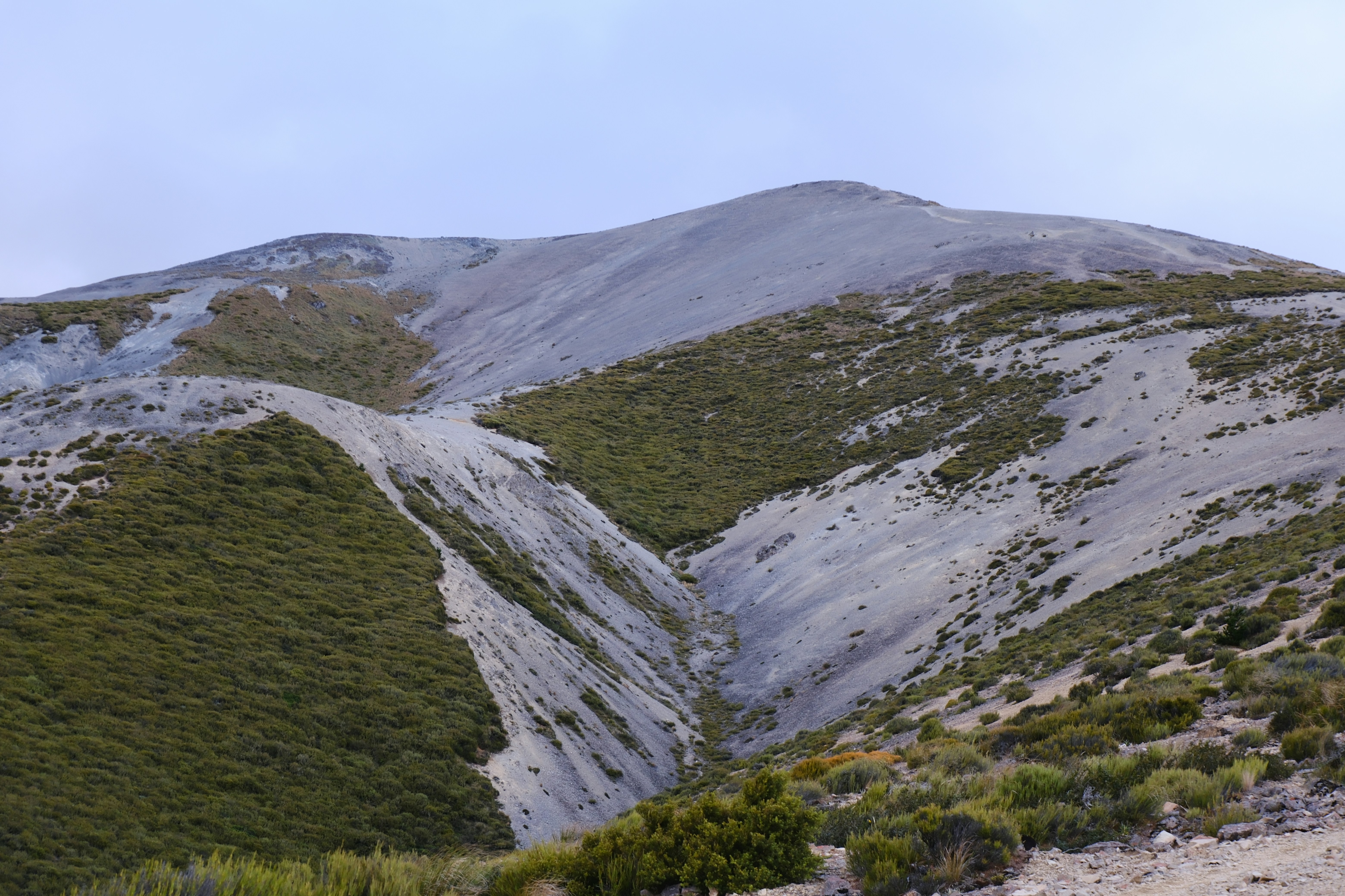 Dusty hillside amphitheater: a quiet valley carved by erosion