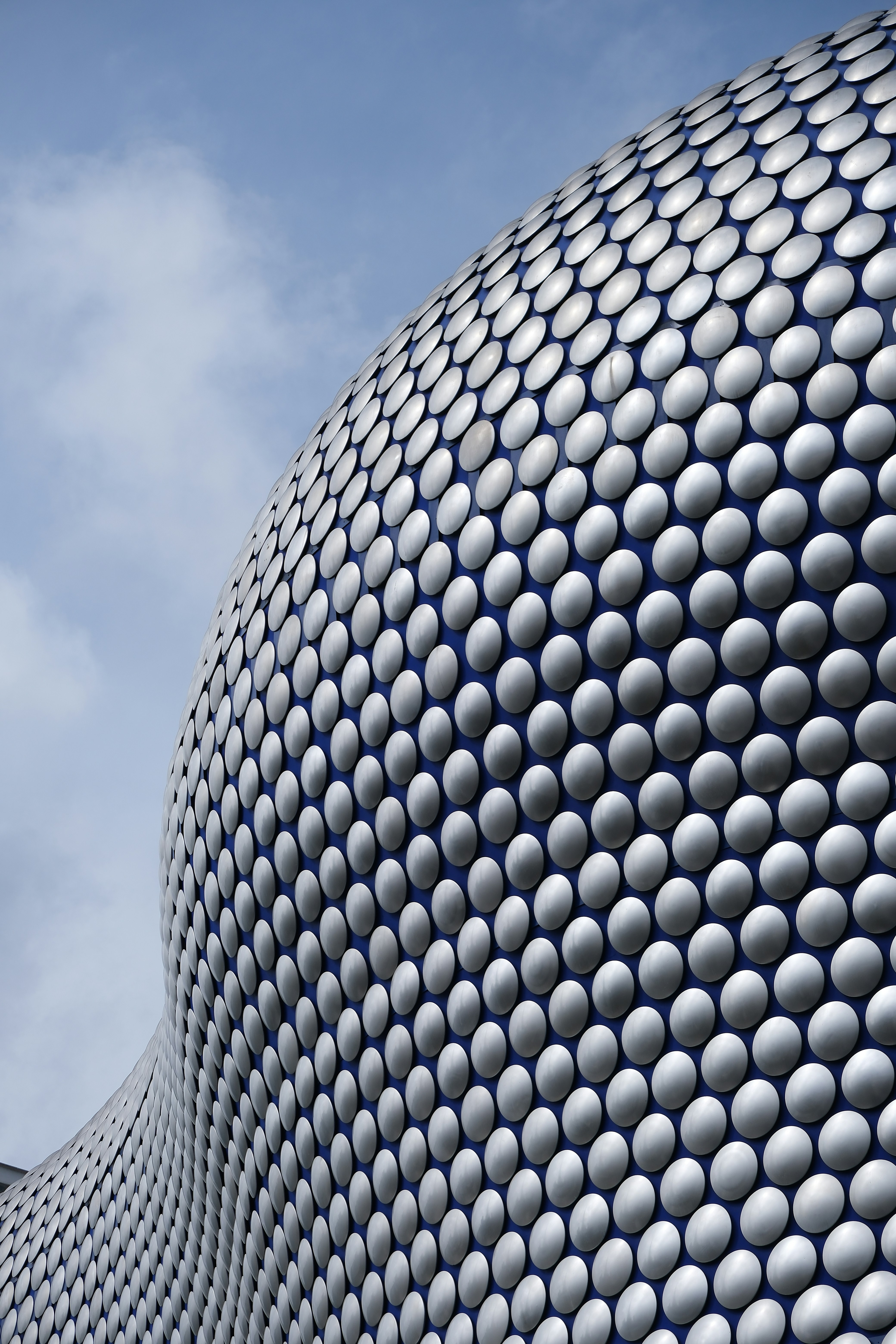 Patterned Dome: A Sea of Metallic Tiles Curving Across the Sky