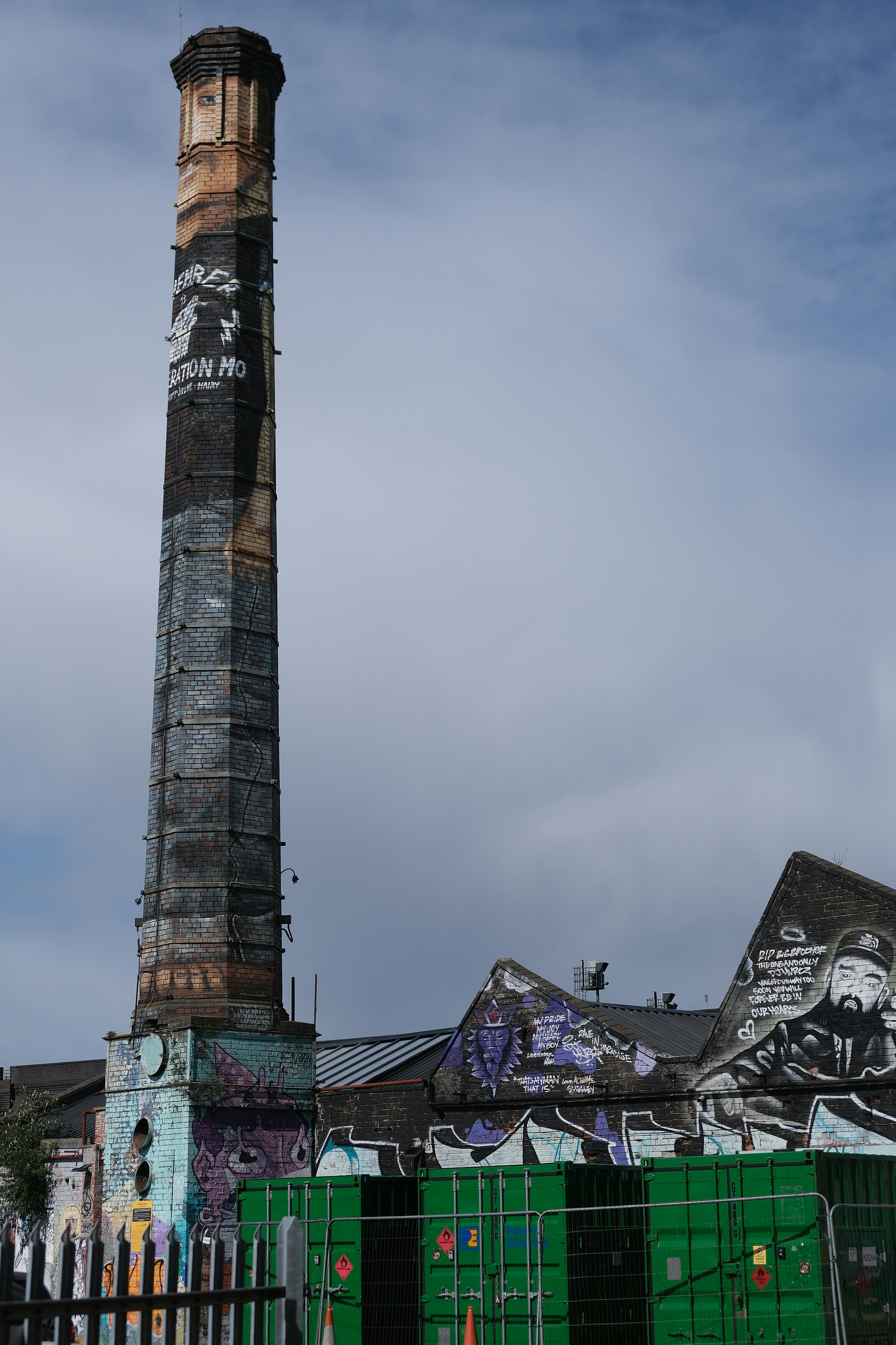 Chimney Keeps Vigil over Graffitied Factory
