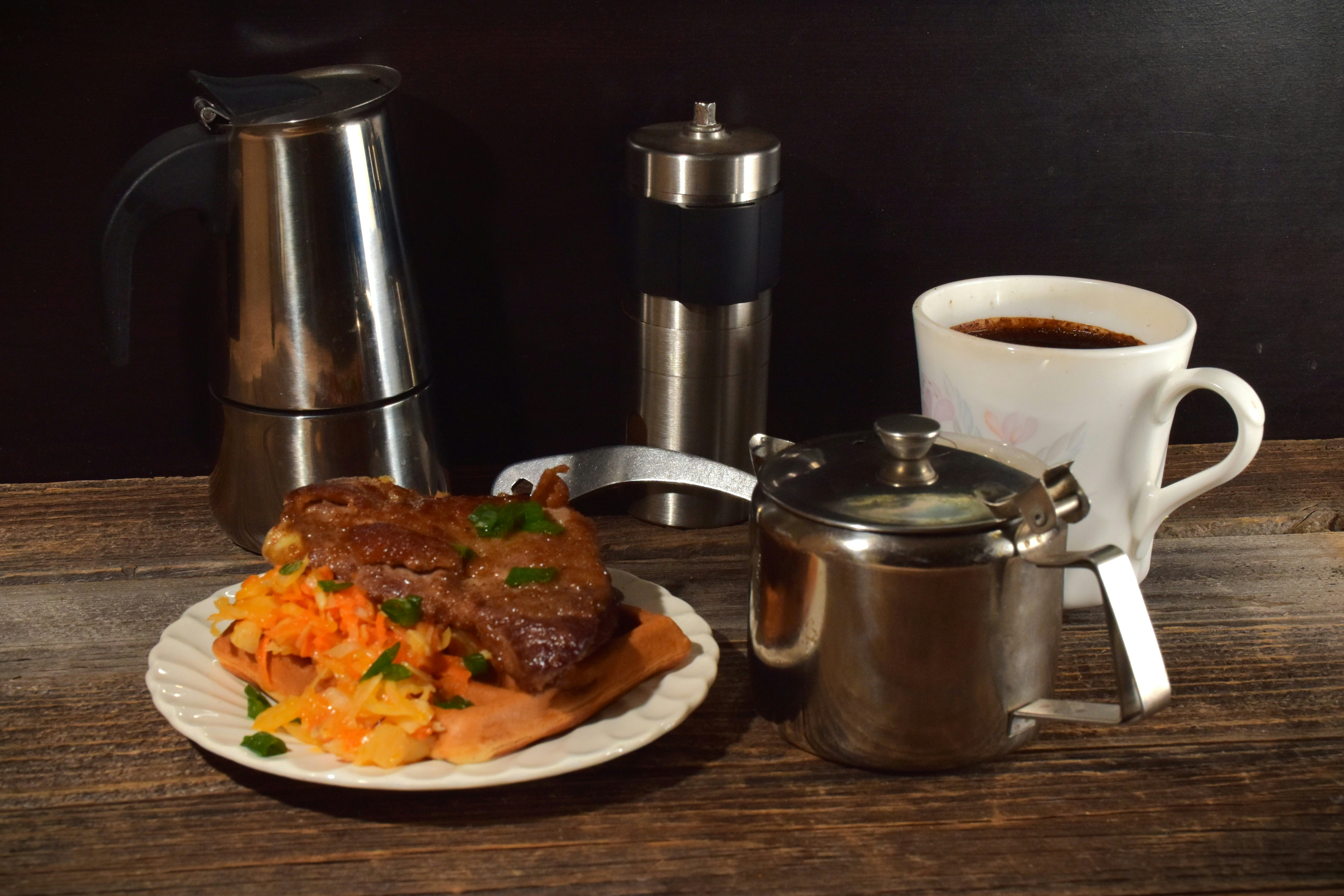 Steak and coffee still life on rustic wooden table