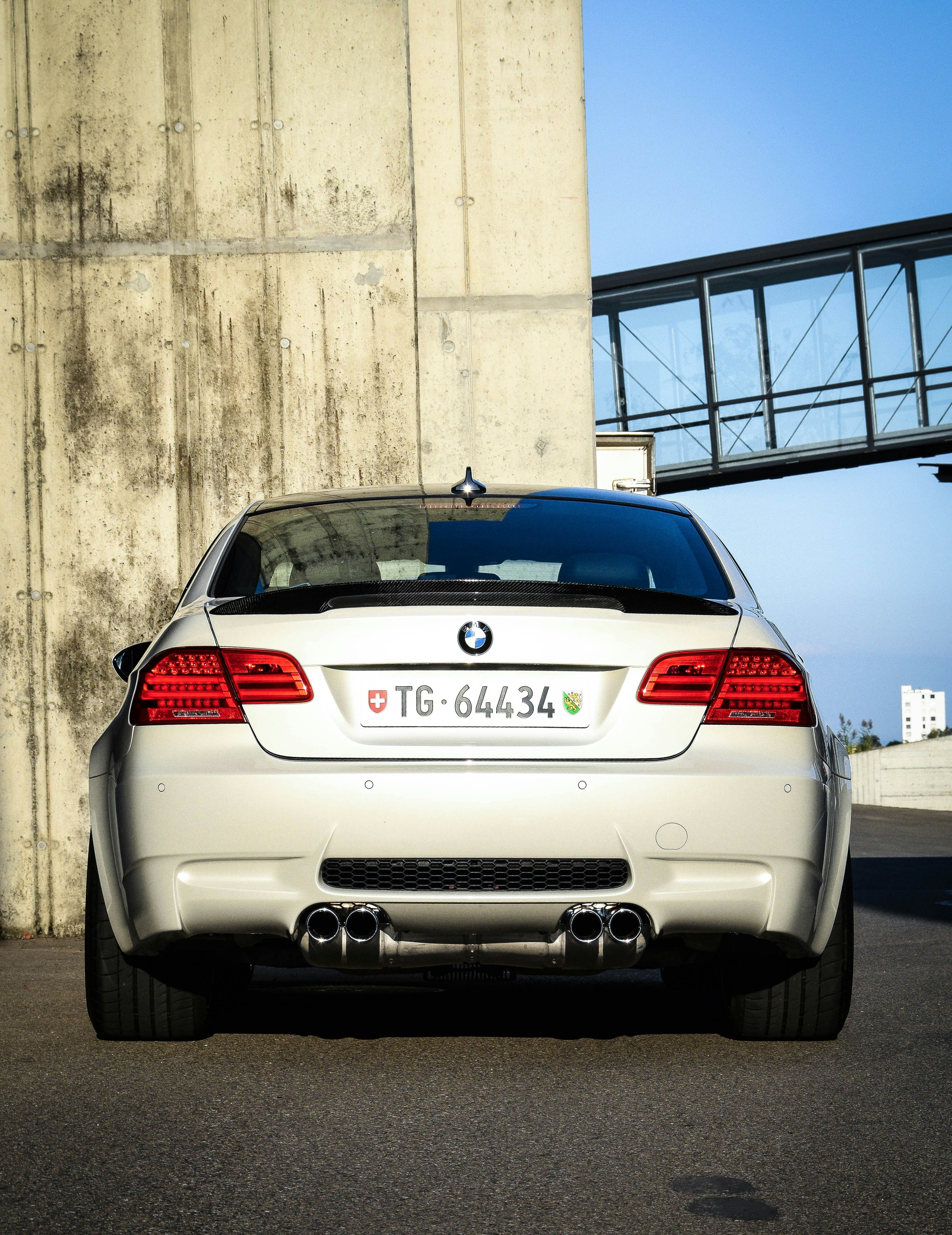 Rear Quarter View: Swiss-boked BMW under an overpass