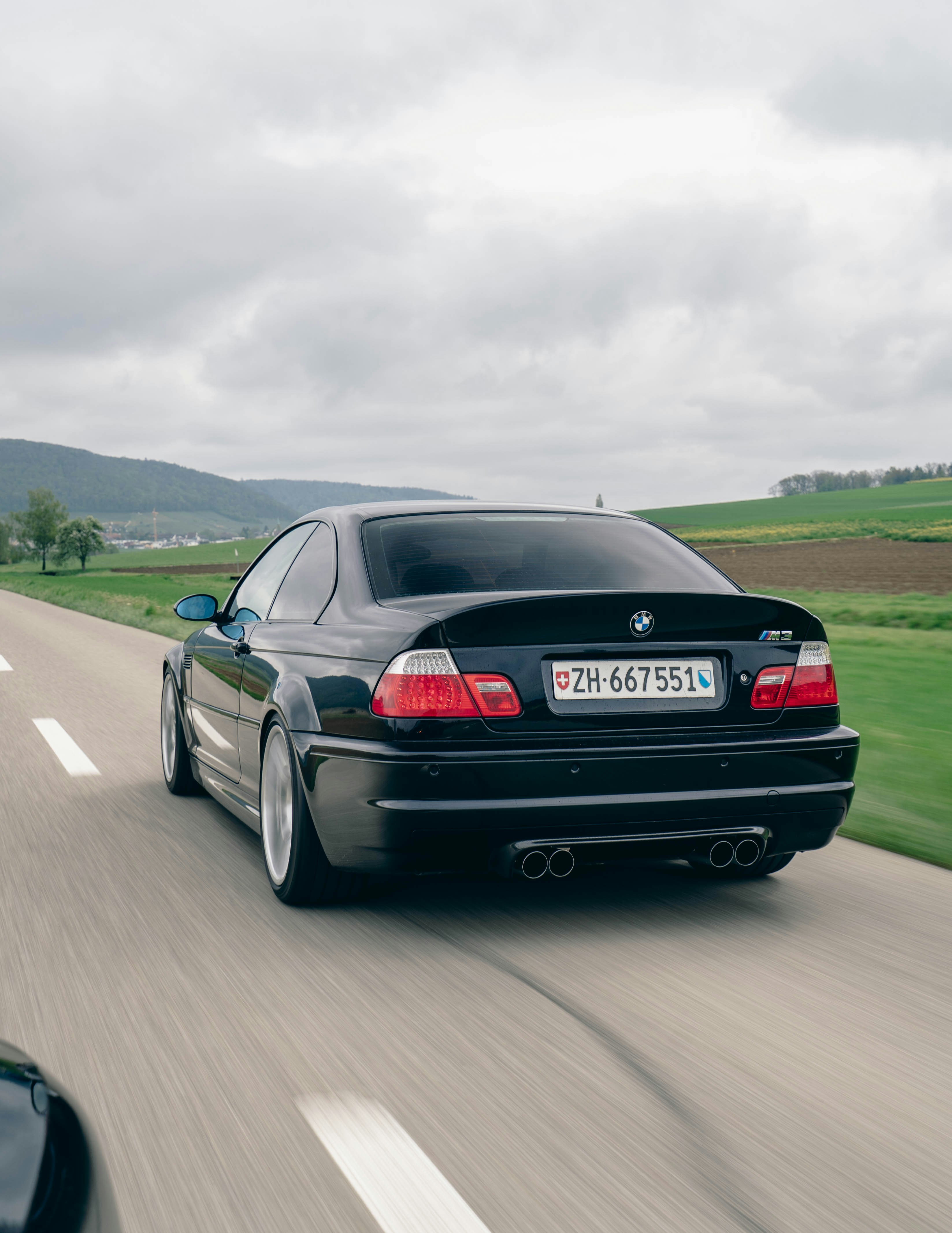 Midnight Speed: BMW’s Shadow Heels Through a Swiss Highway
