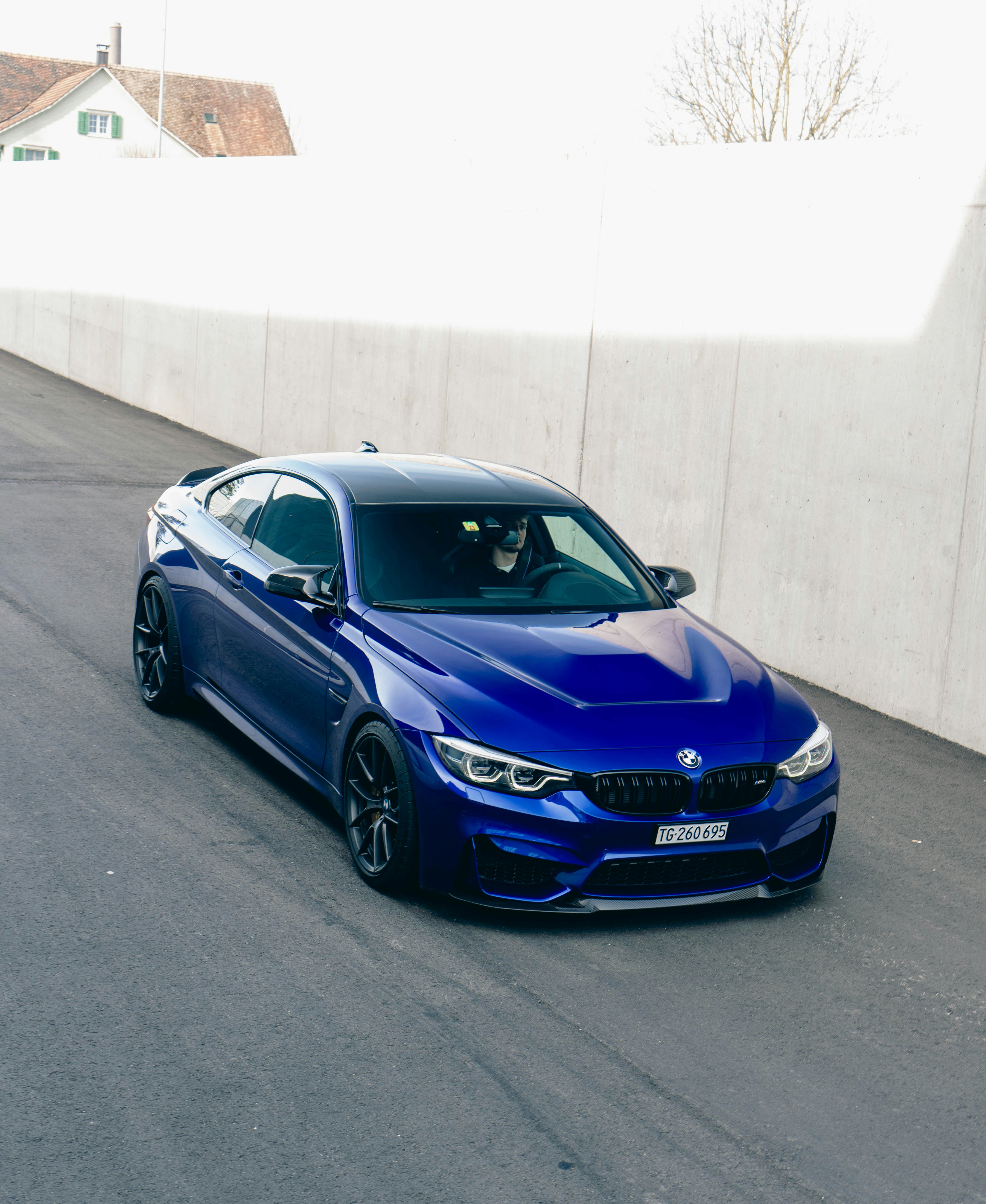 Midnight Sapphire: A sharp blue BMW prowls a quiet curve