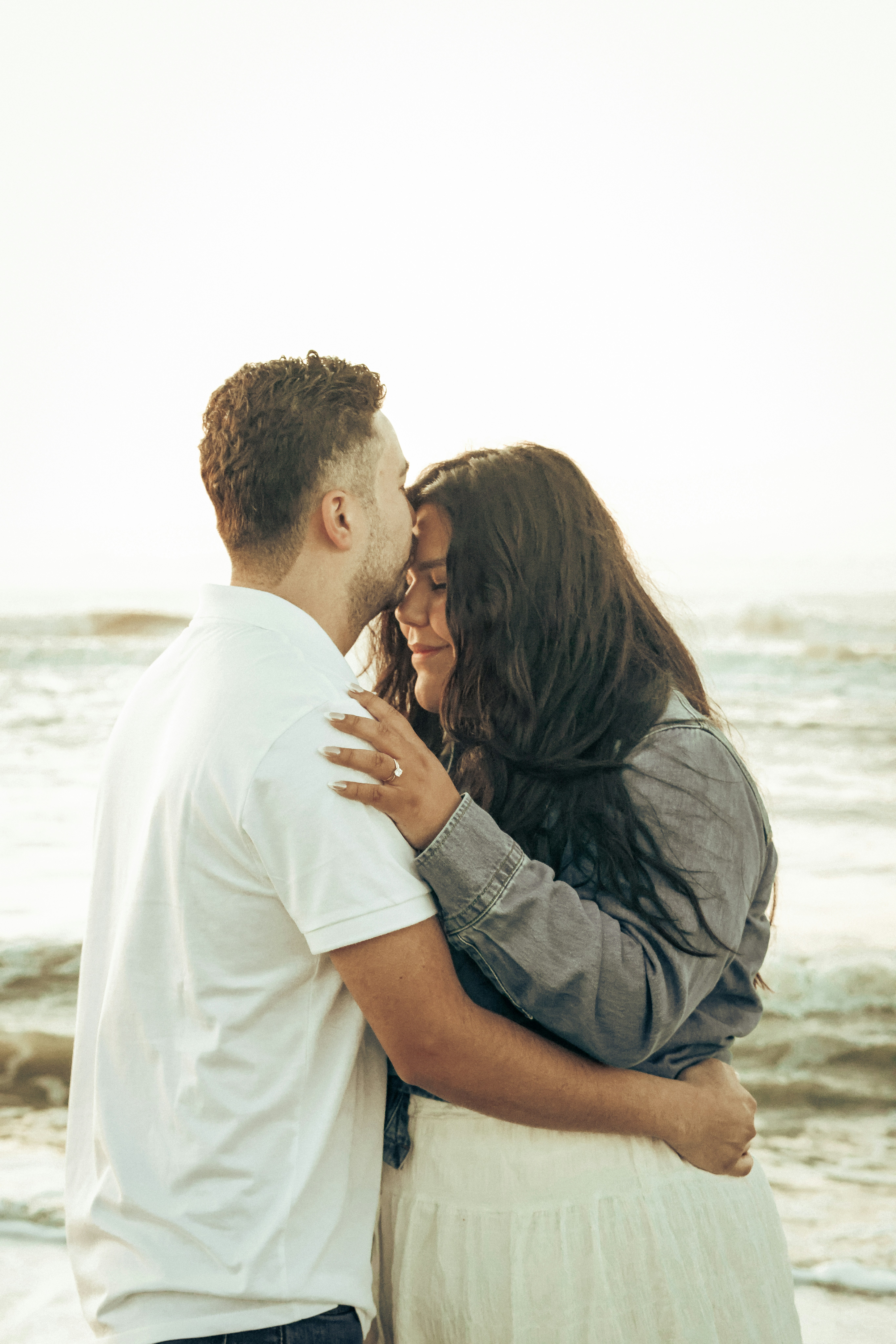 Whispers at the Shore: A Tender Embrace at Dusk