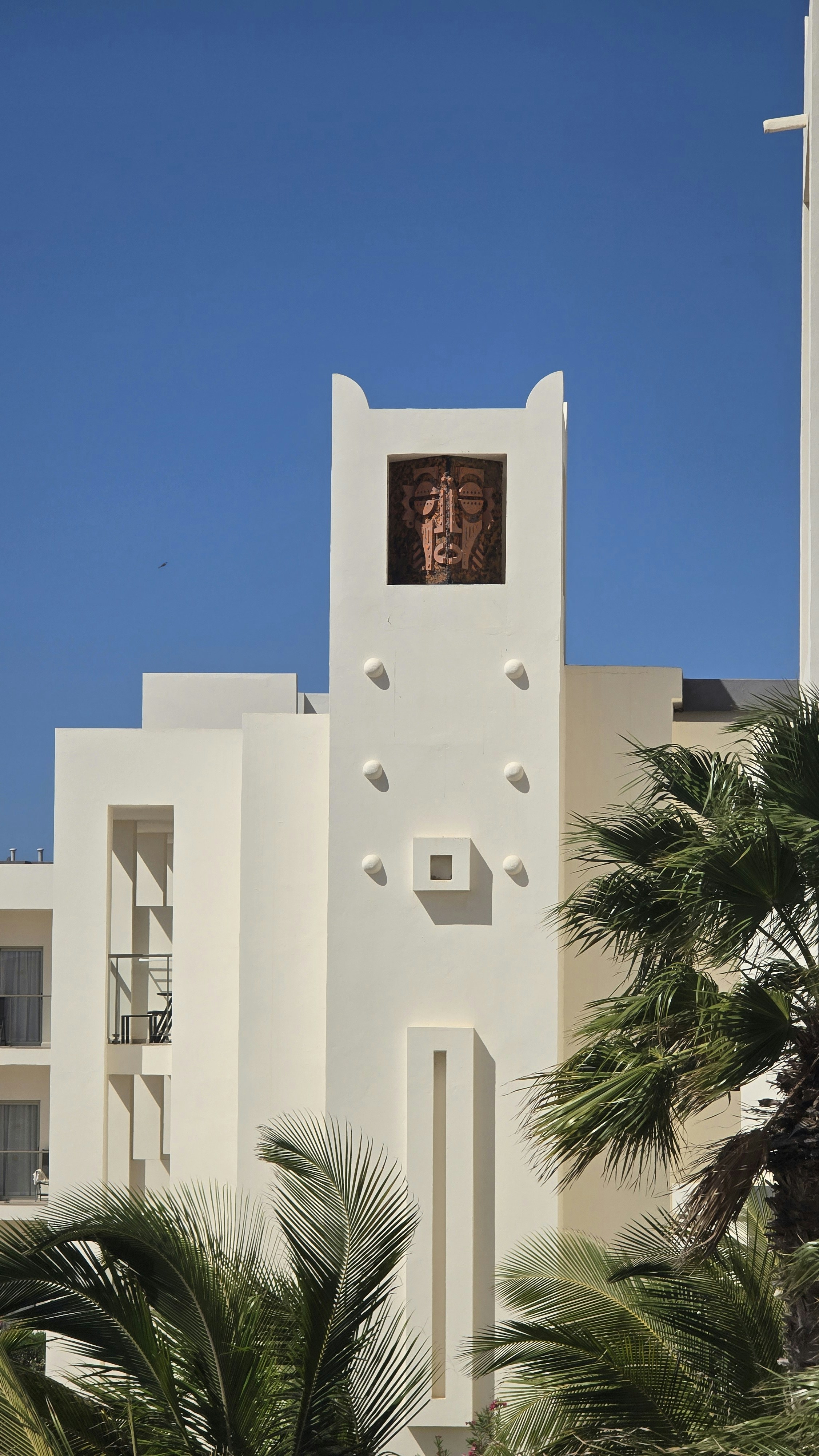 Cubist Clock Tower in Whitewashed Oasis
