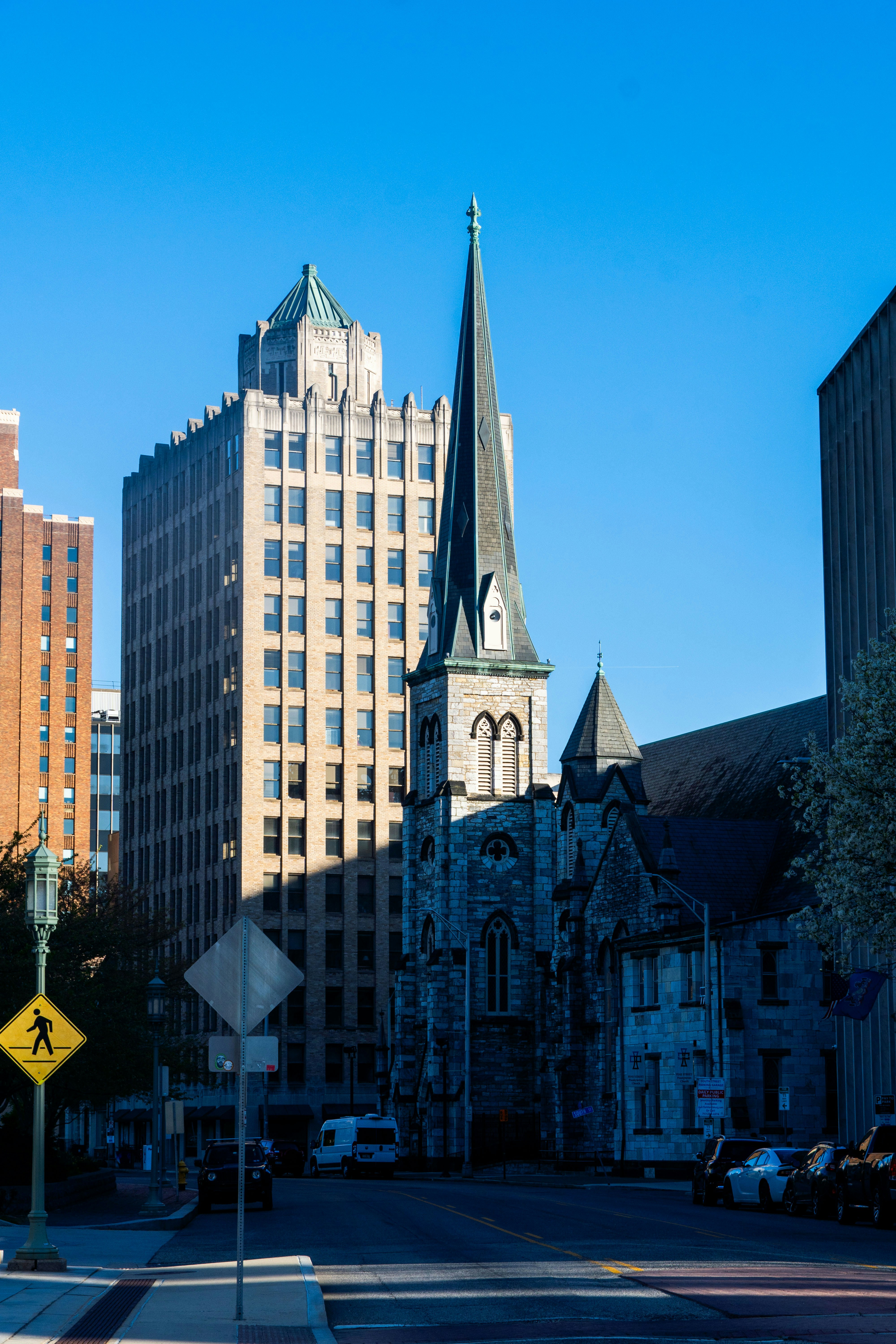 Urban Cathedral Spire Surrounded by Glass and Brick