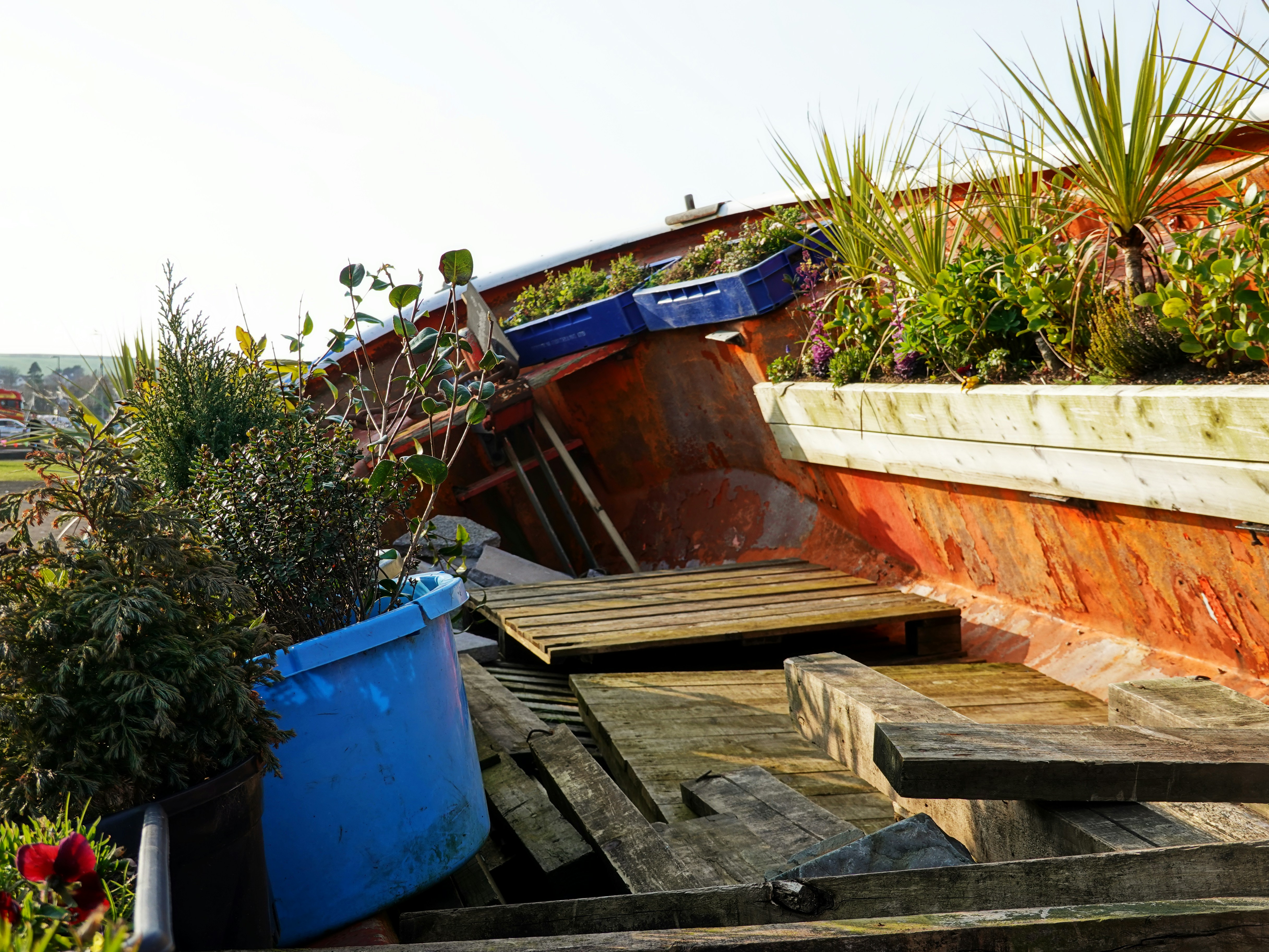 Sunlit Carved Deck of a Rusted Boat