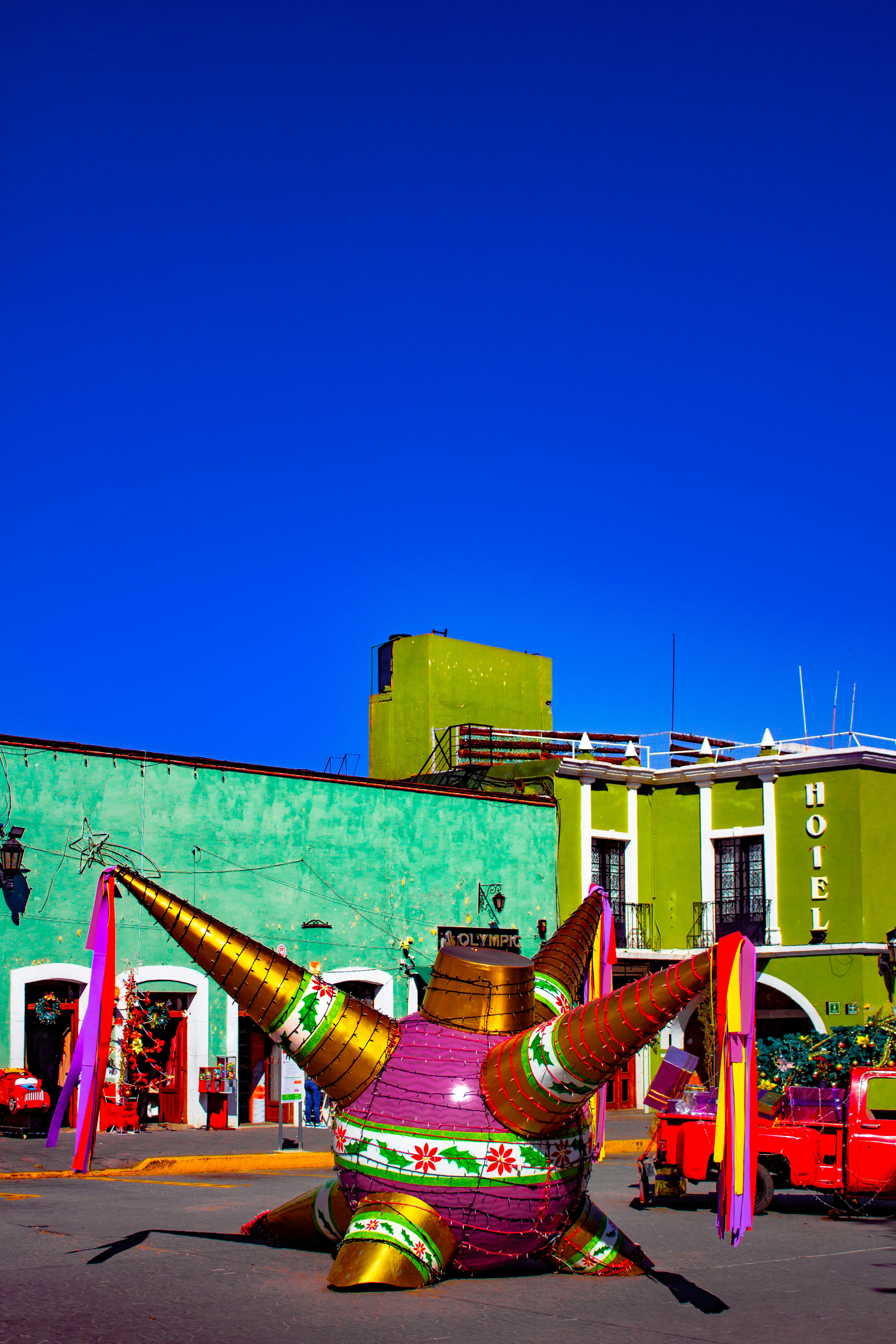 Festive Spire: A Colorful Rig Parade in Bright Baja Light