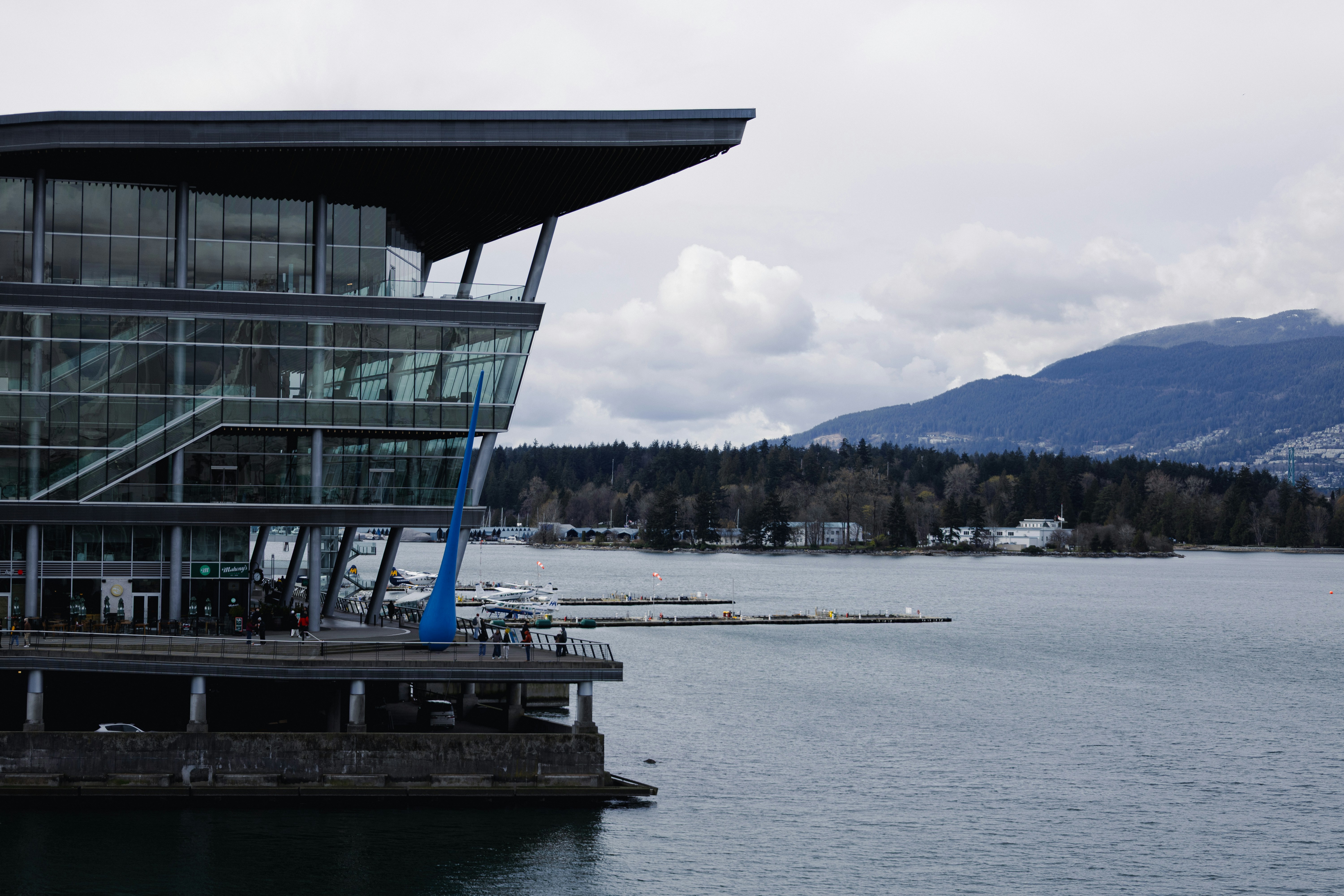 Architectural shoreline: glass and water at the harbor edge