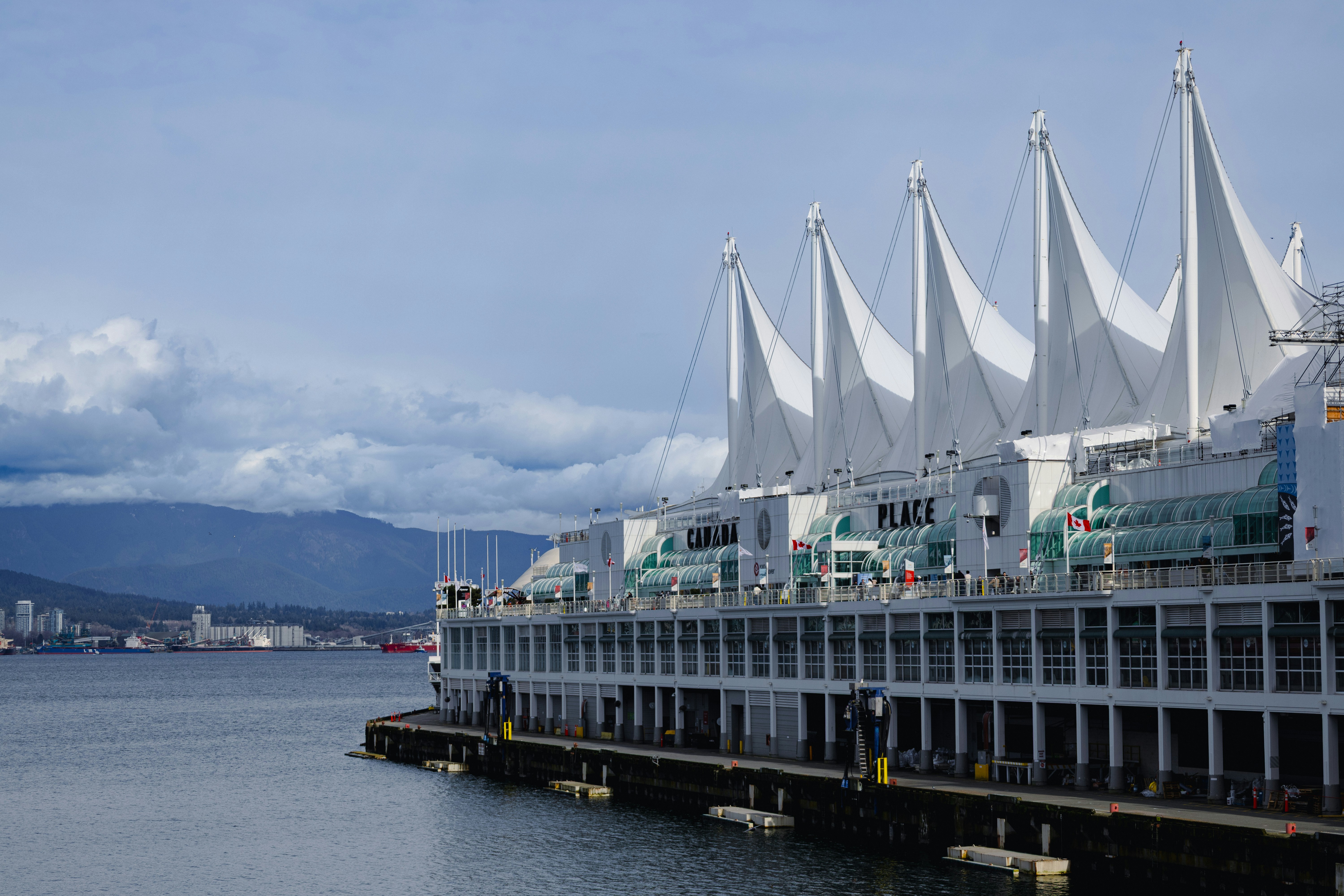 Pierfront Pavilion: Sailcloth Supremacy over calm harbor